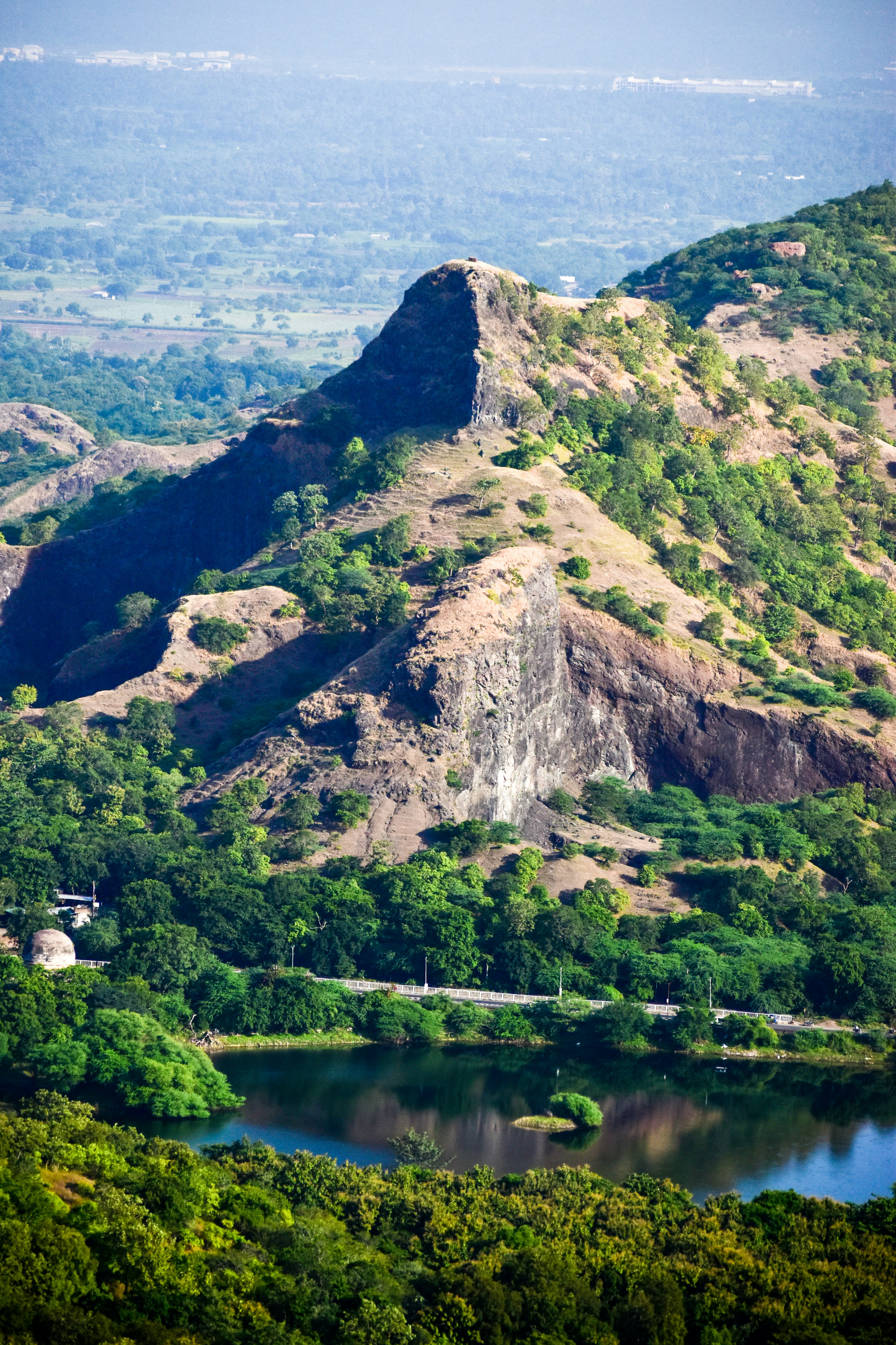 A mountain with a lake in the middle of it photo – Free Pavagadh hills ...