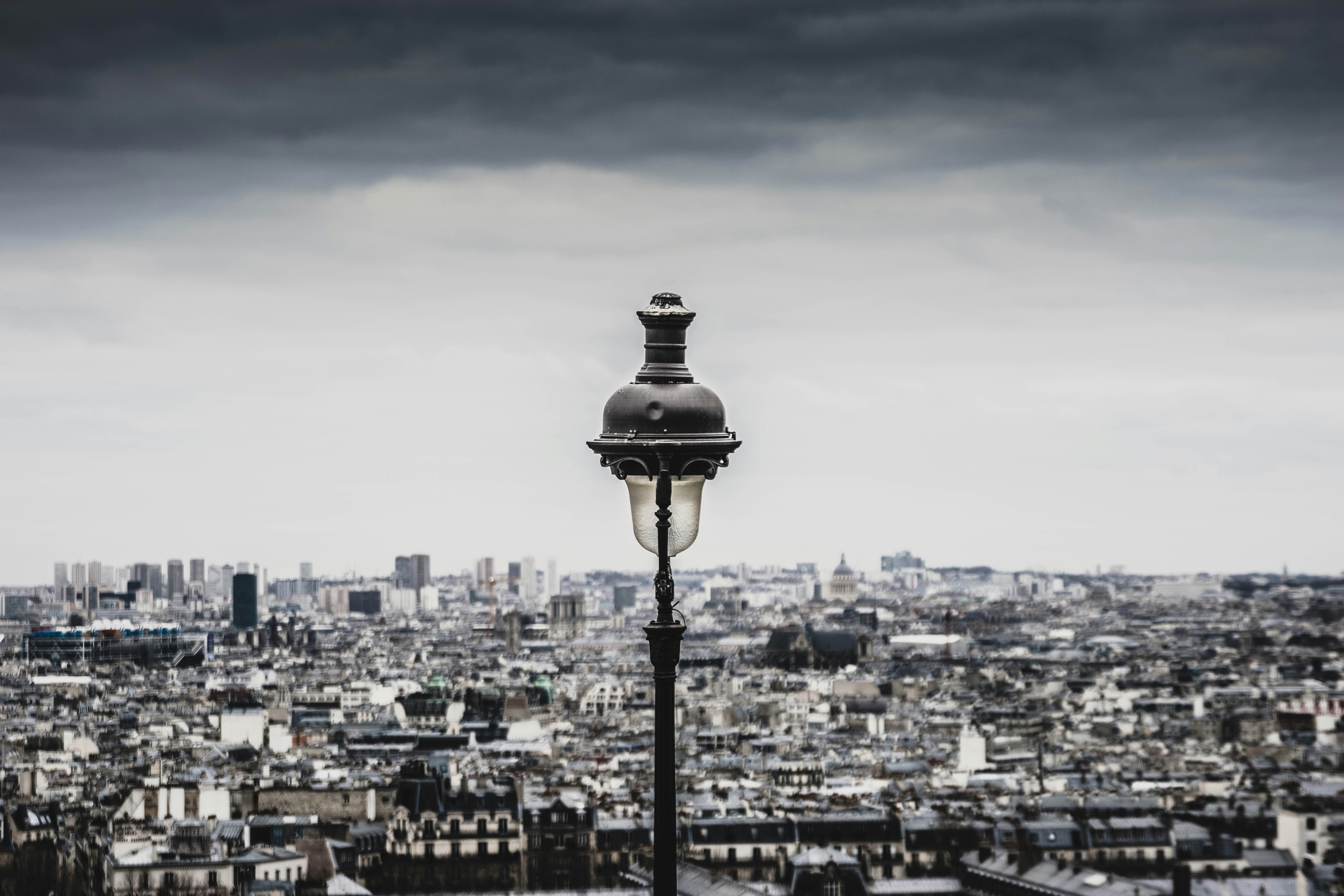 Urban Beacon: A Street Lamp Over the City Horizon