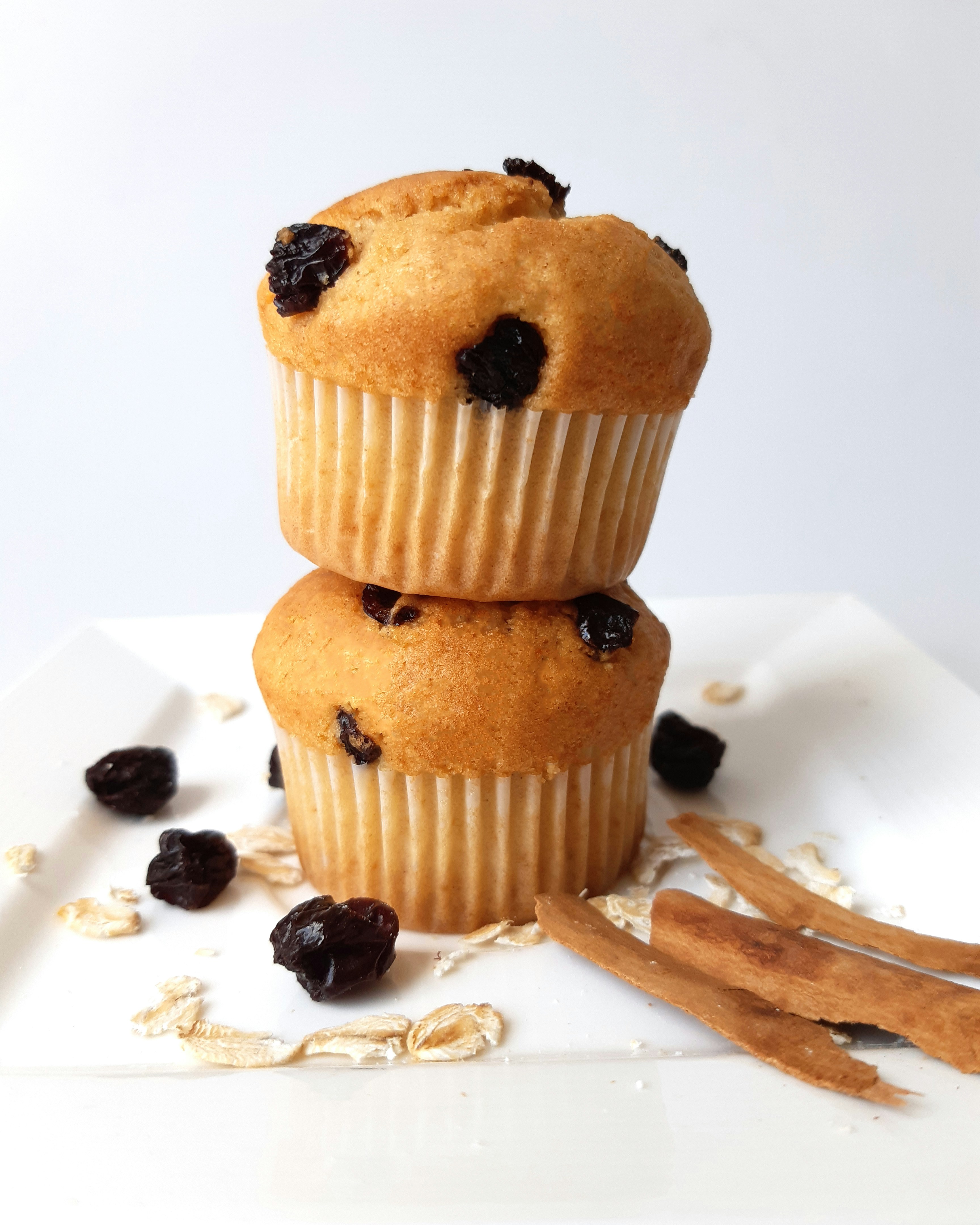 Three muffins stacked on top of each other on a plate photo – Free ...