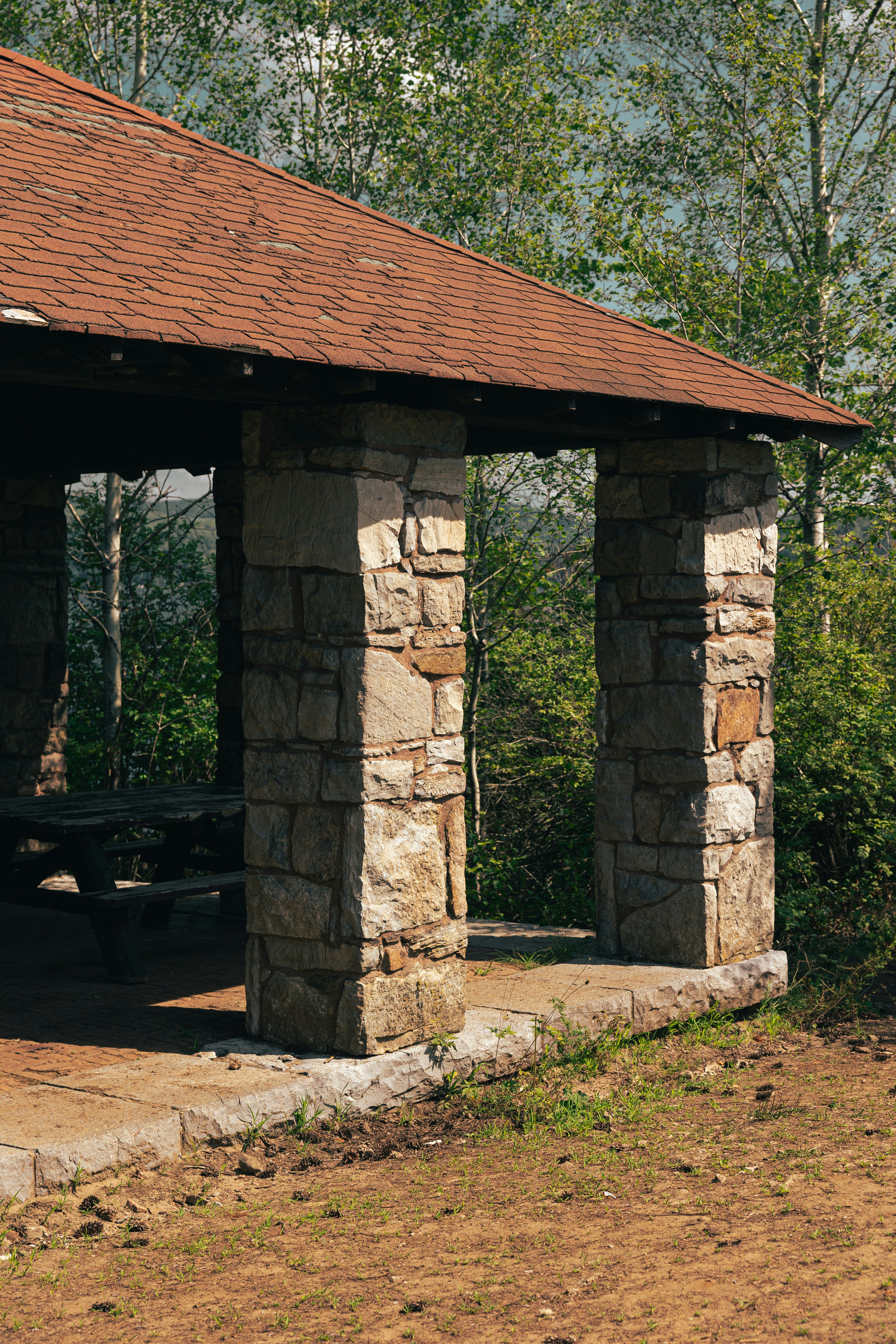 Stone Pavilion in Dappled Light: A Quiet Forest Shelter
