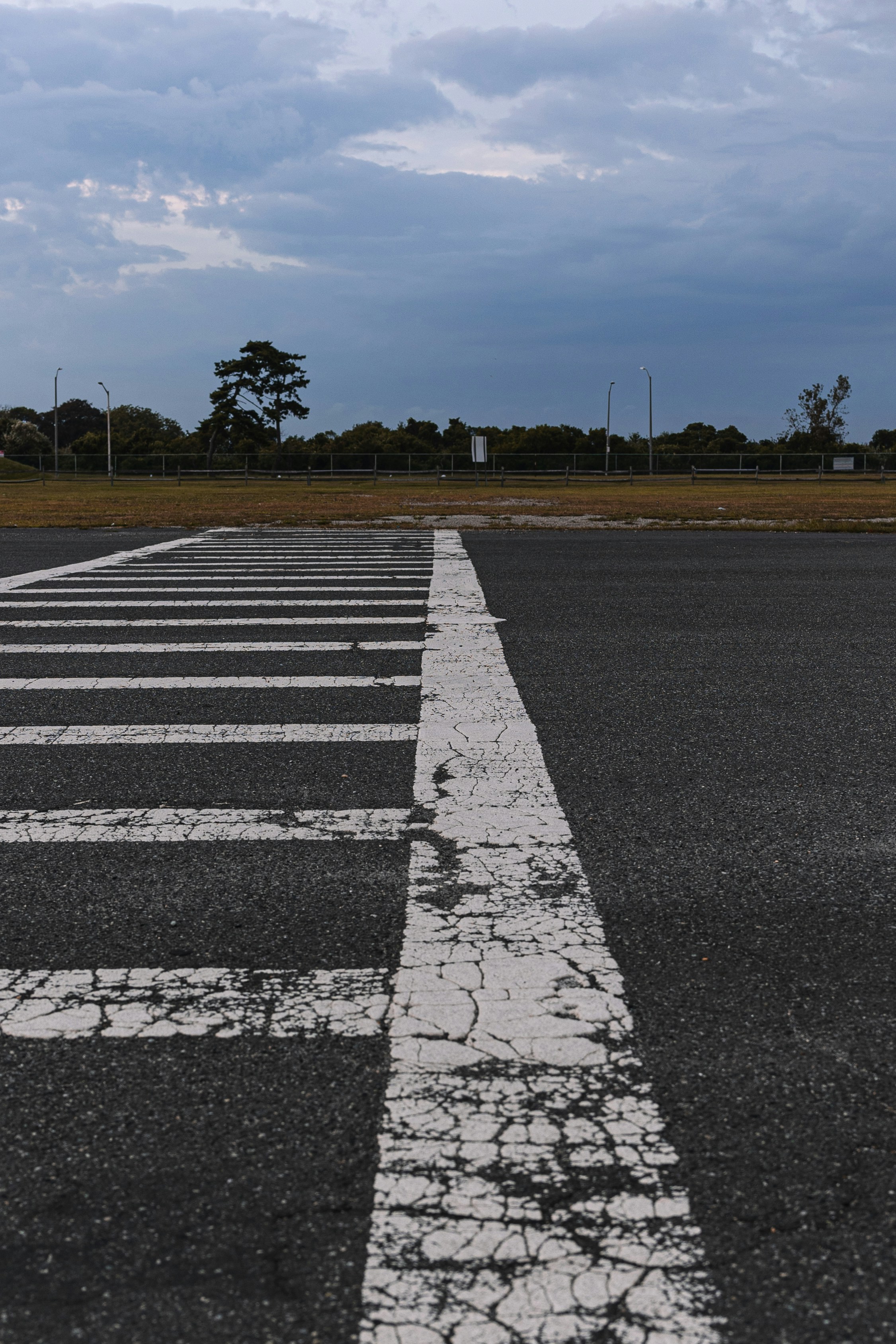 an empty parking lot with a sky background