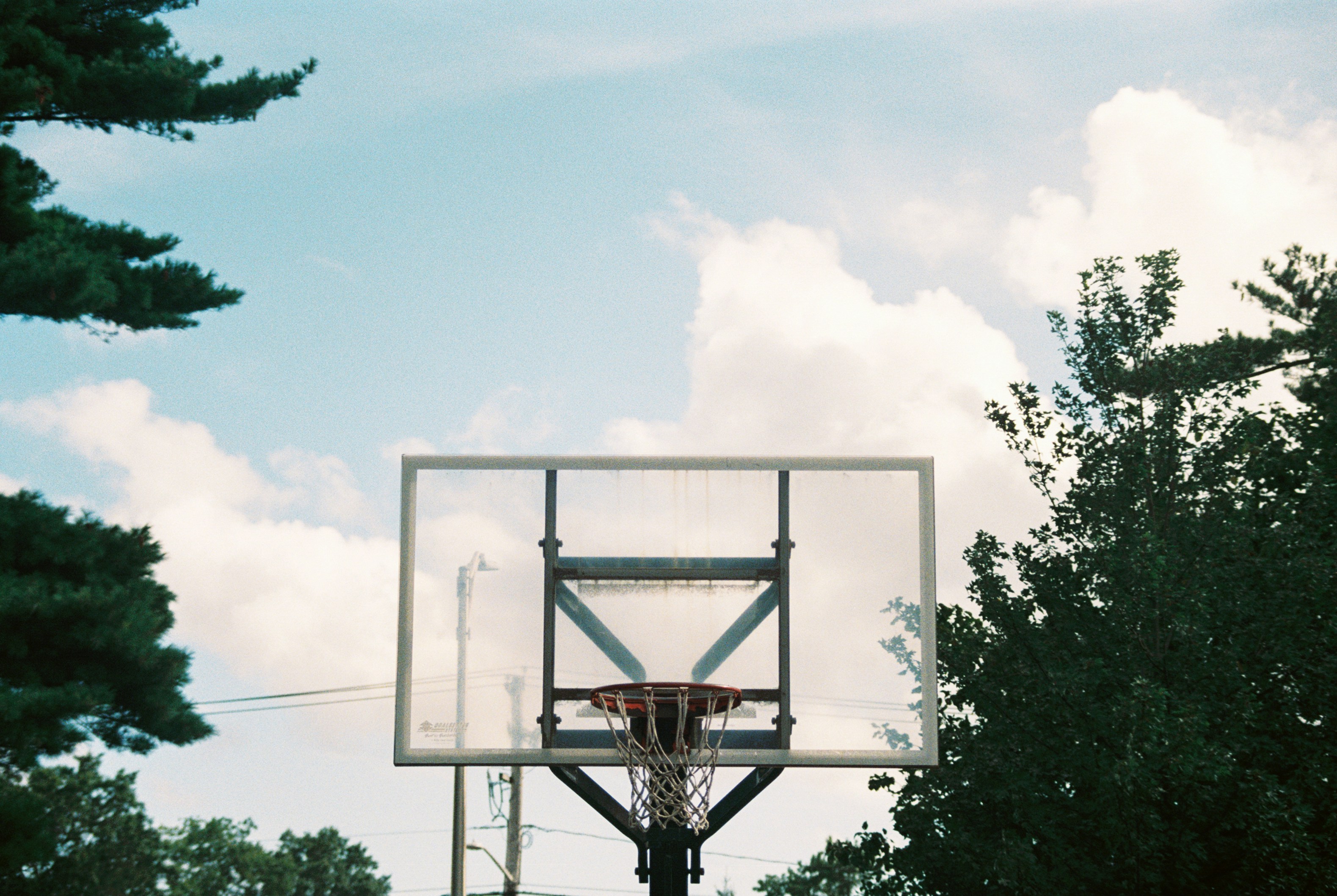 A basketball hoop with a basketball inside of it photo – Free 35mm ...