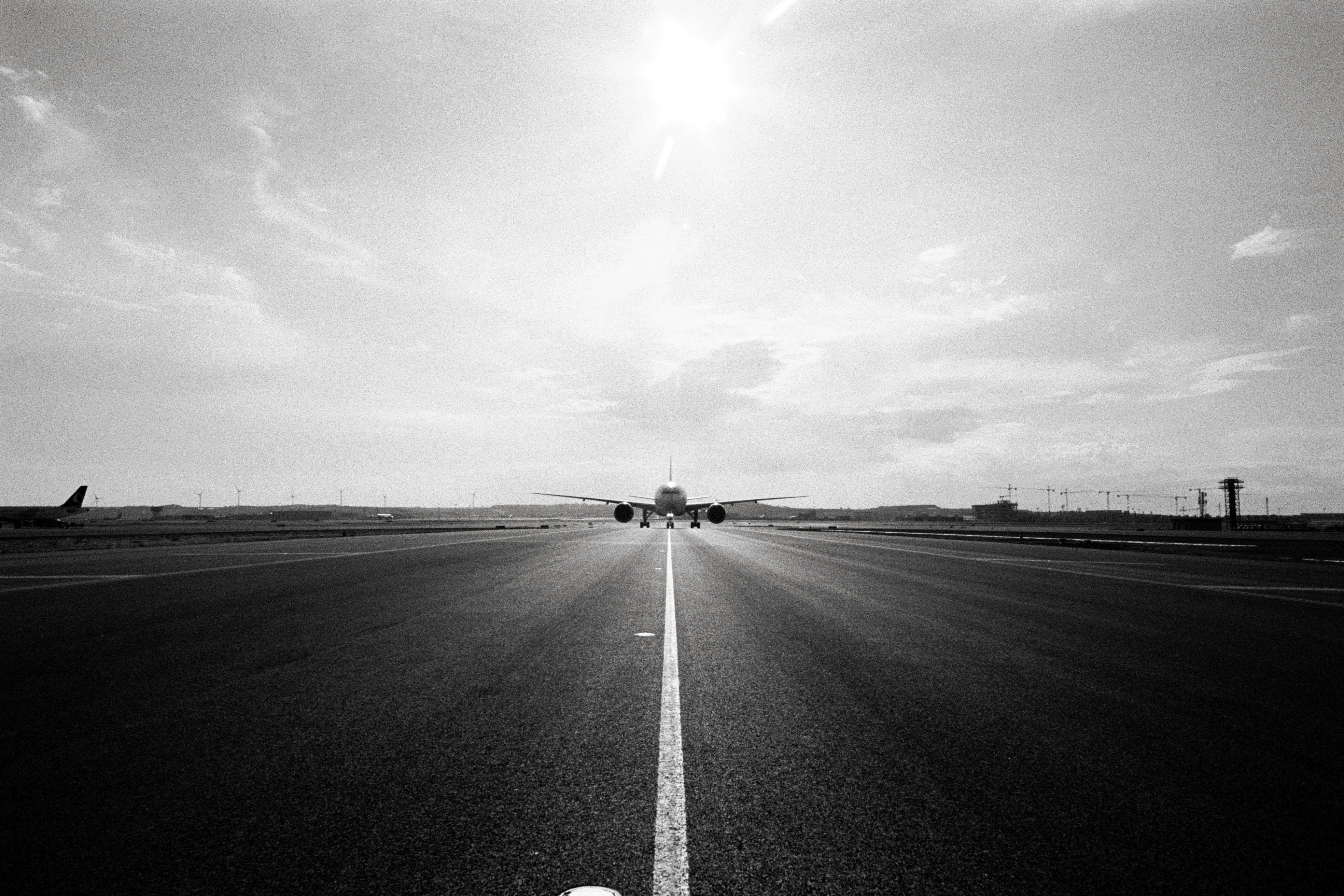 A black and white photo of an airport runway photo – Free Grey Image on ...