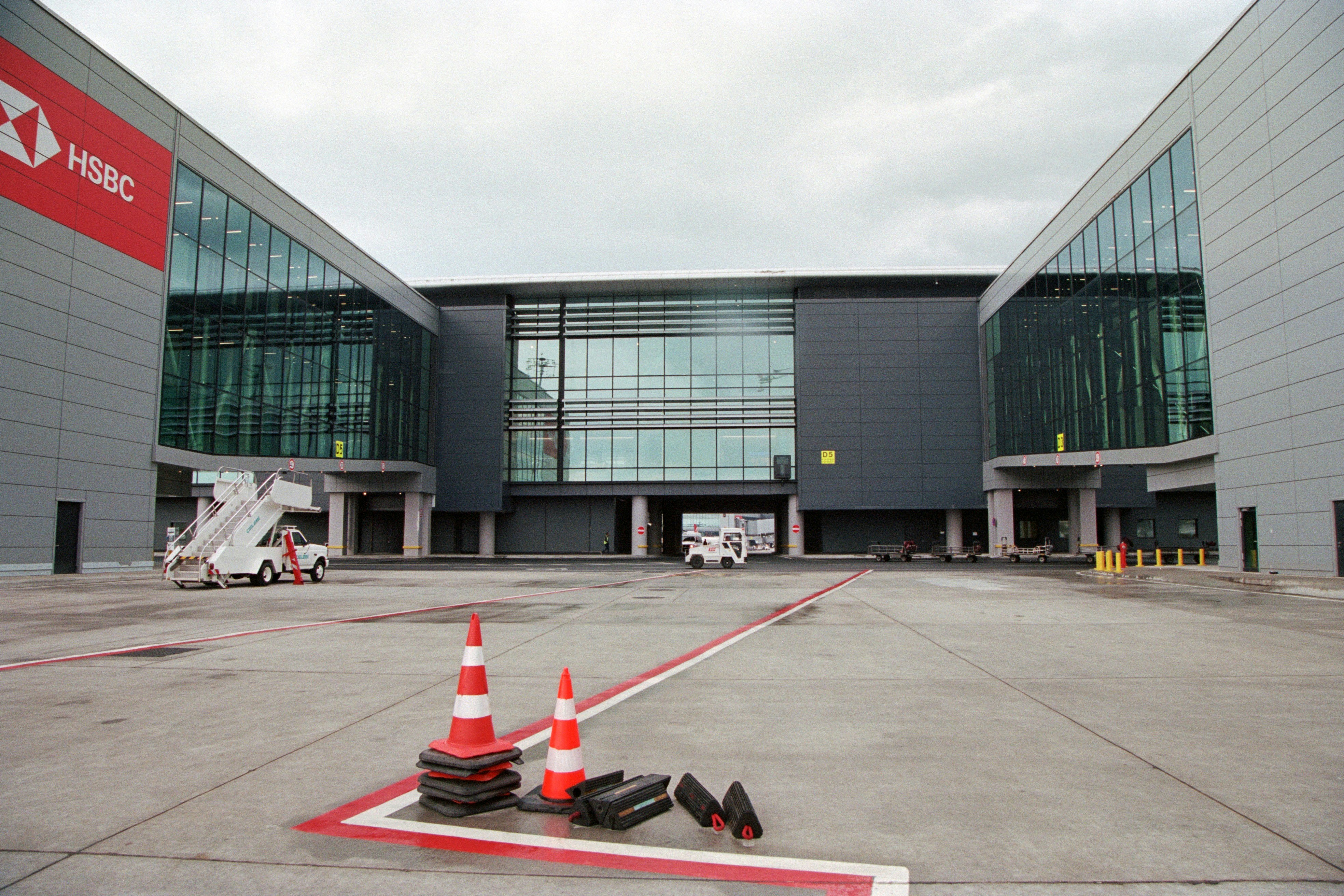 A large building with a lot of windows and a lot of traffic cones photo ...