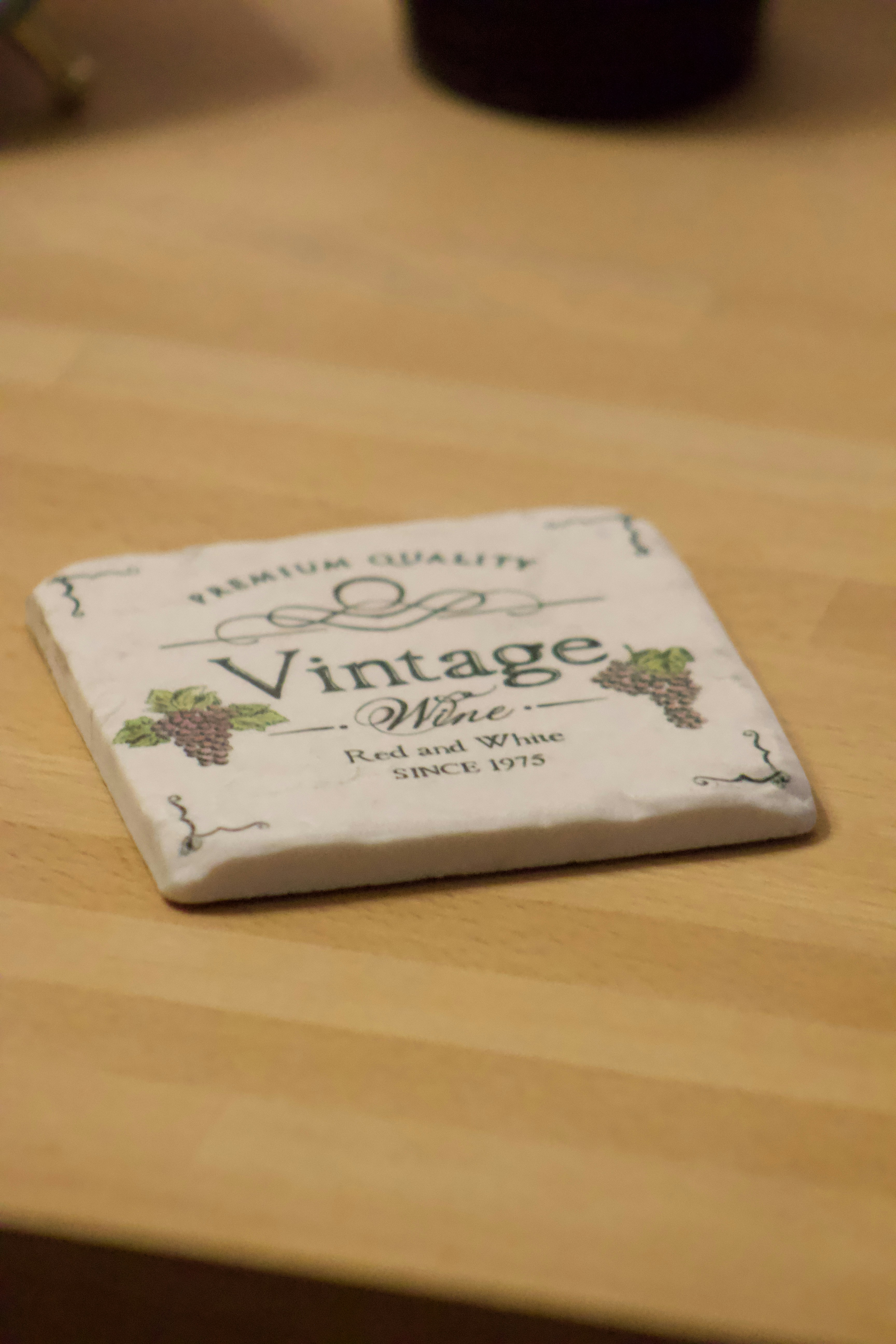 Tiny Vintage Wine Label on Warm Wood