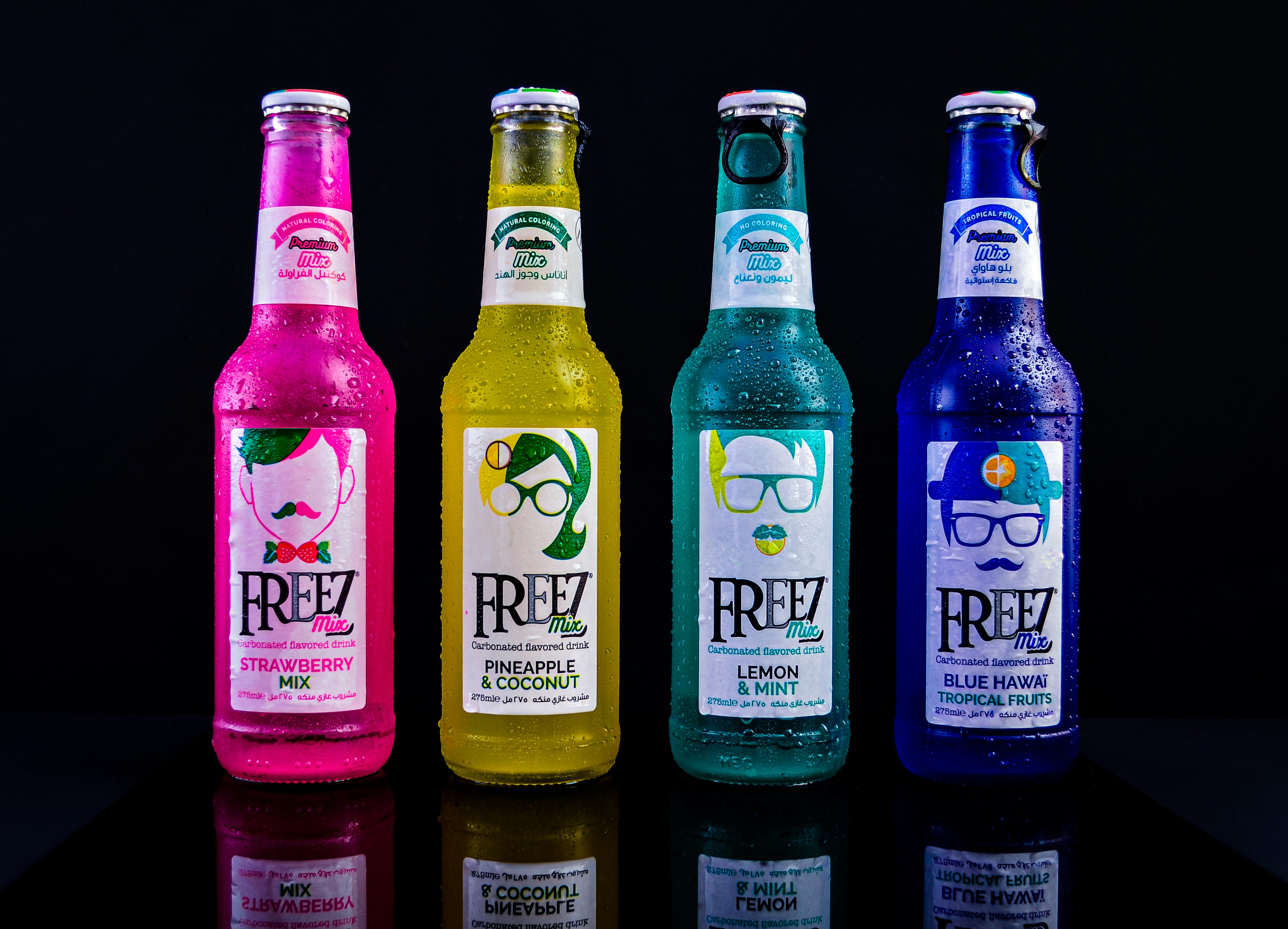 Neon Bottles in a Velvet Studio: A Row of Fruity Flavors Reflected on Black Glass