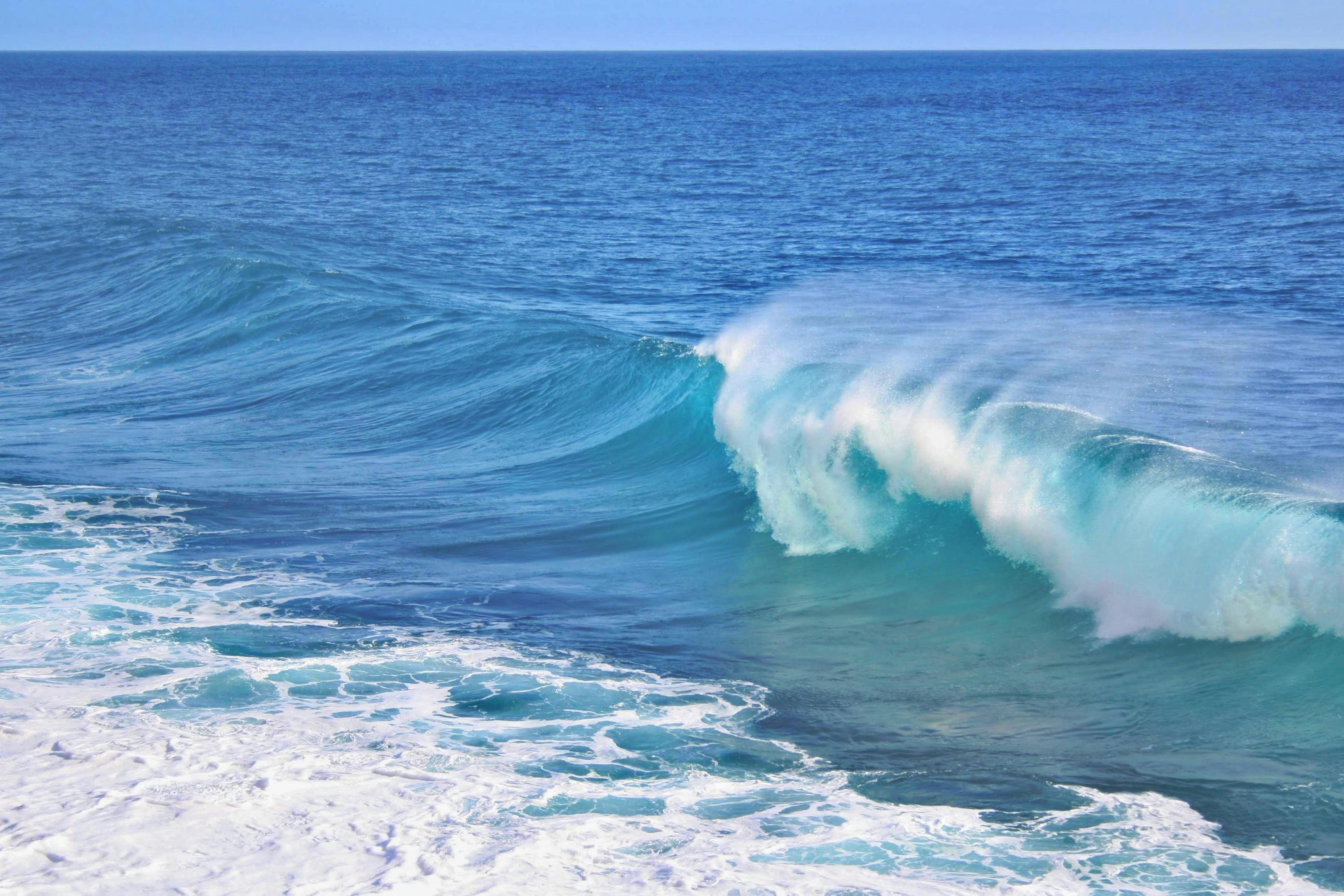 A large blue wave breaking into the ocean photo – Free Jardim do mar ...