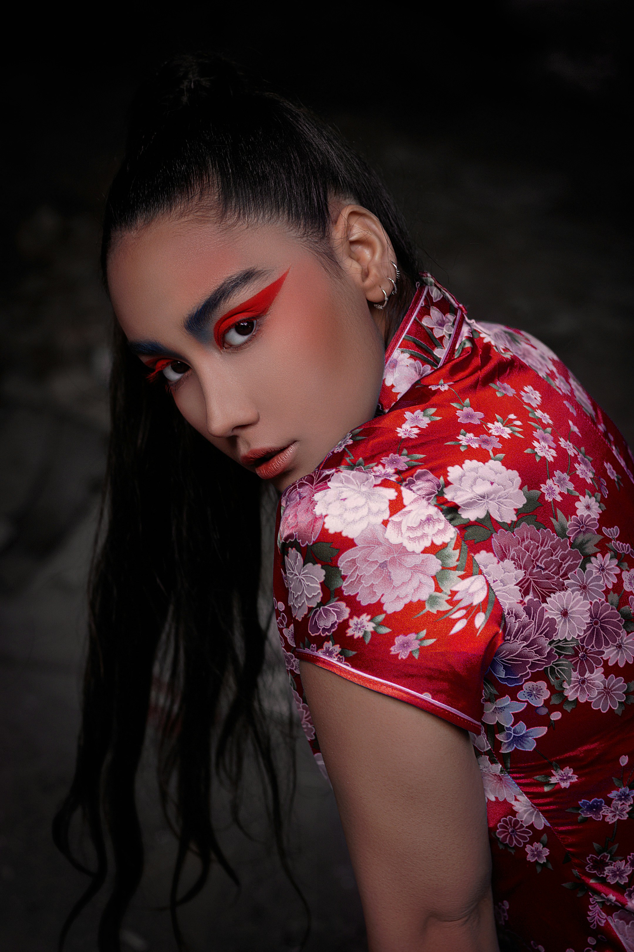 A woman in a red dress with black makeup photo – Free Iran Image on ...