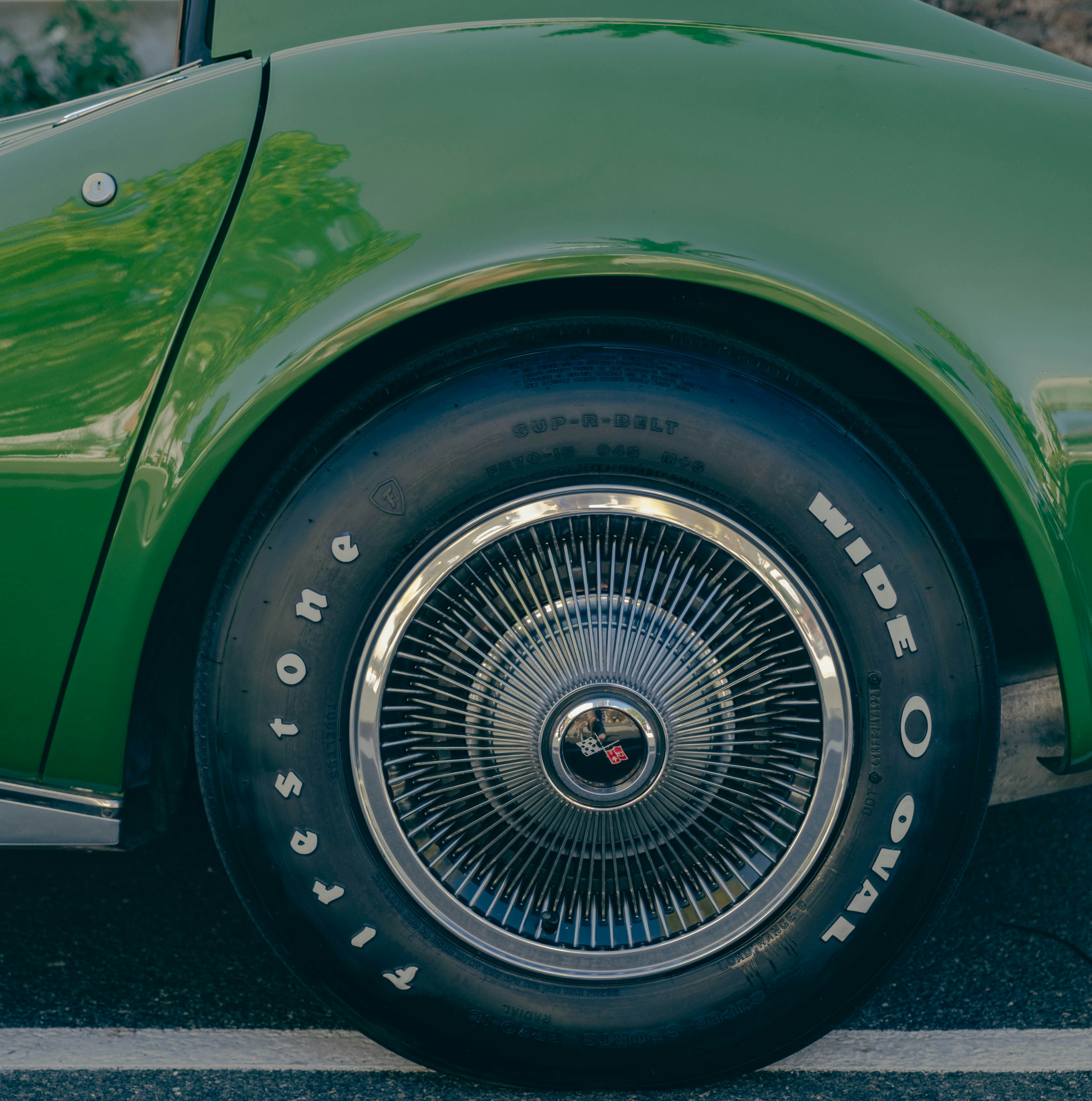 Emerald Crown: Chrome Spokes on a Classic Green Wheel