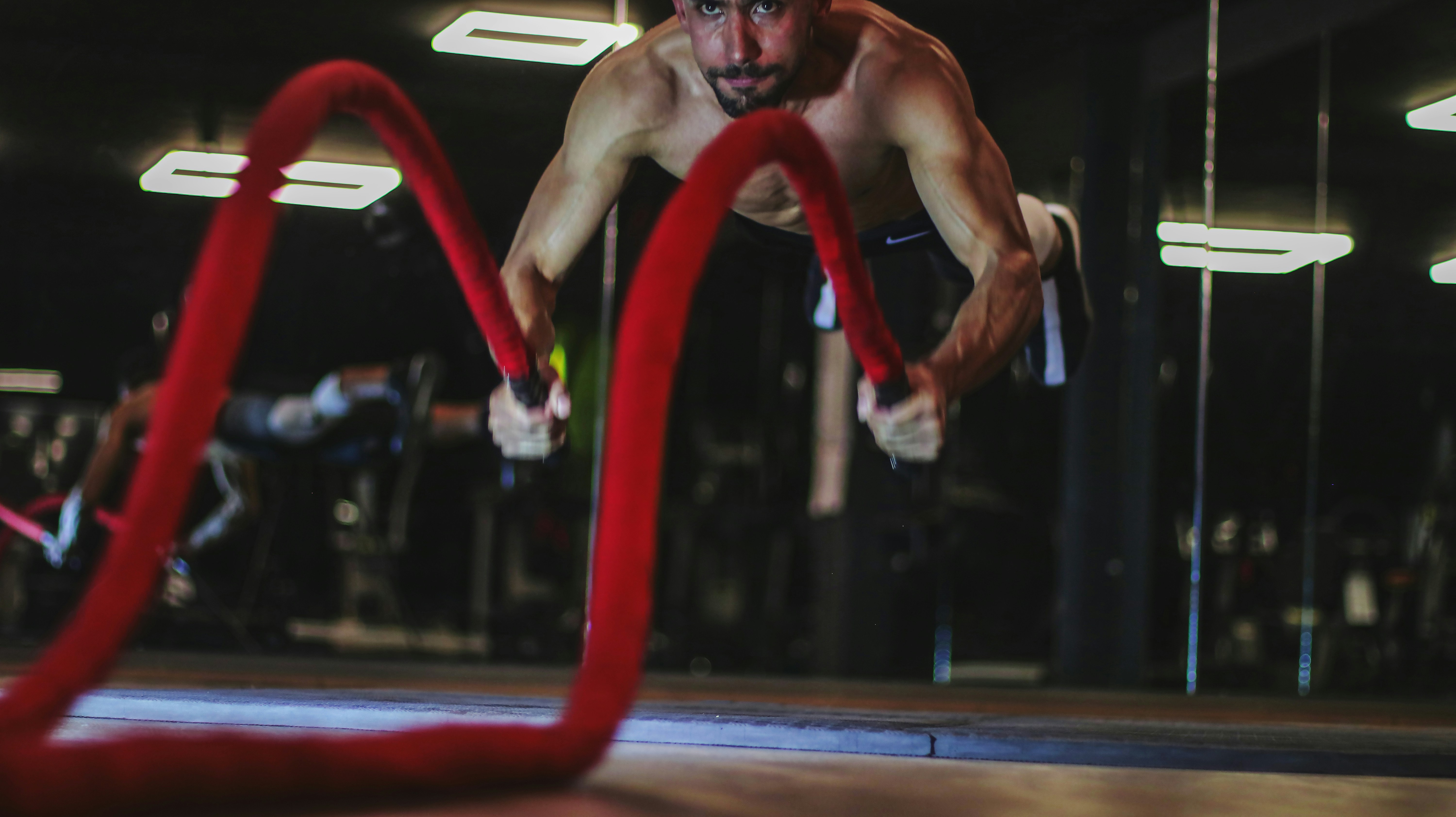 A man doing a push up on a red rope photo – Free Sport Image on Unsplash