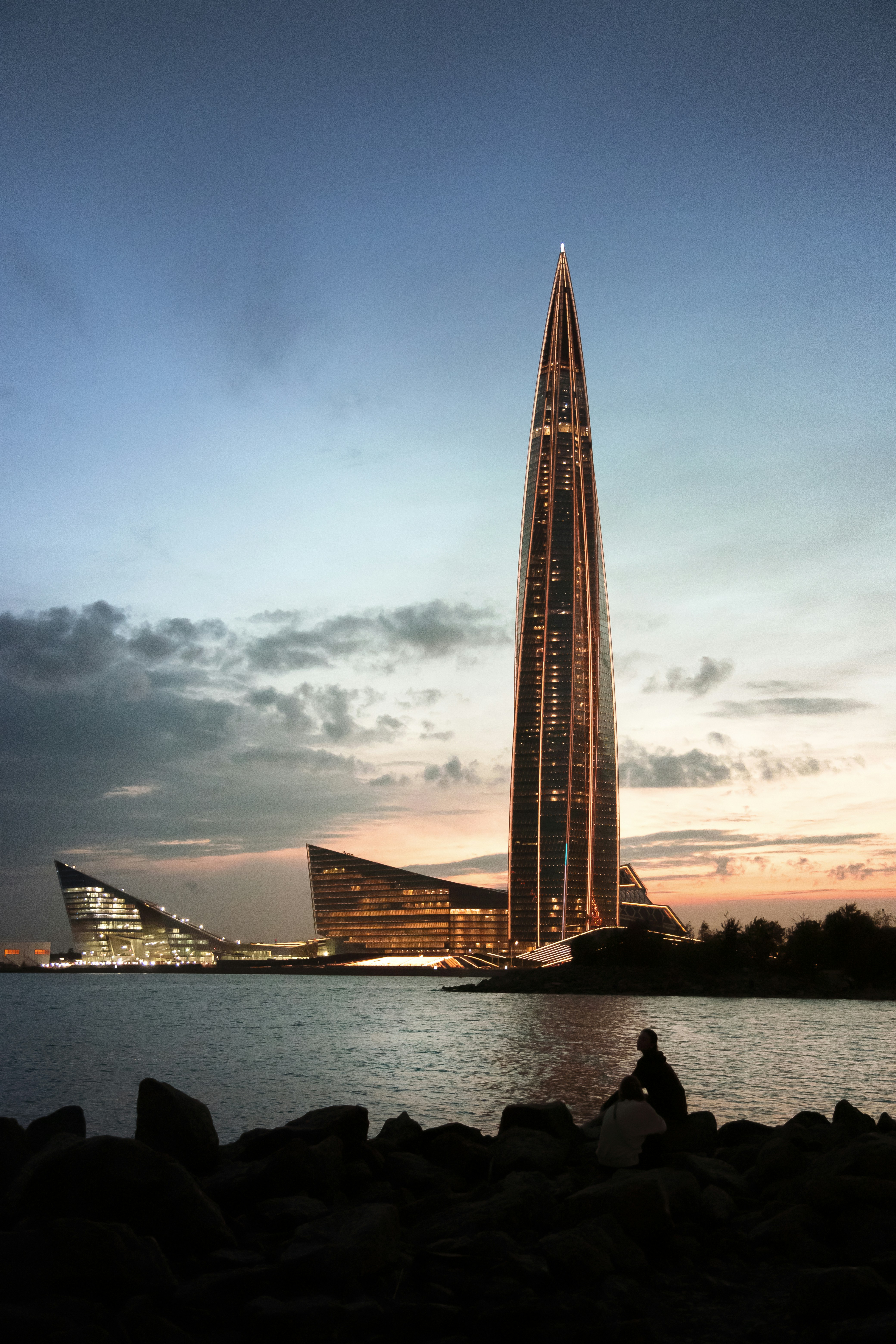 Dusk Spire Over the Waterfront: A Sleek Glass Beacon Rises