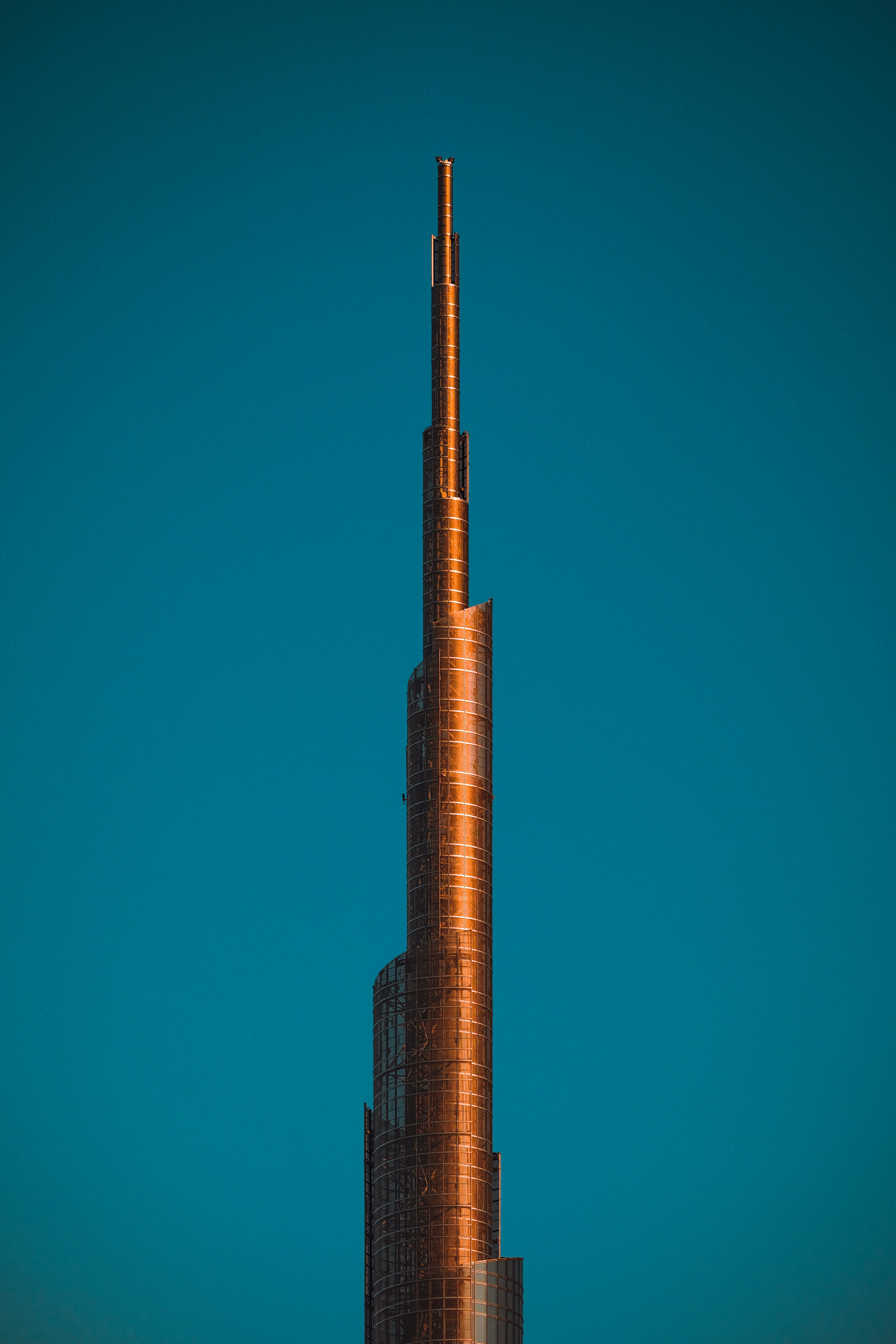 A very tall building with a very tall tower photo – Free Blue Image on ...