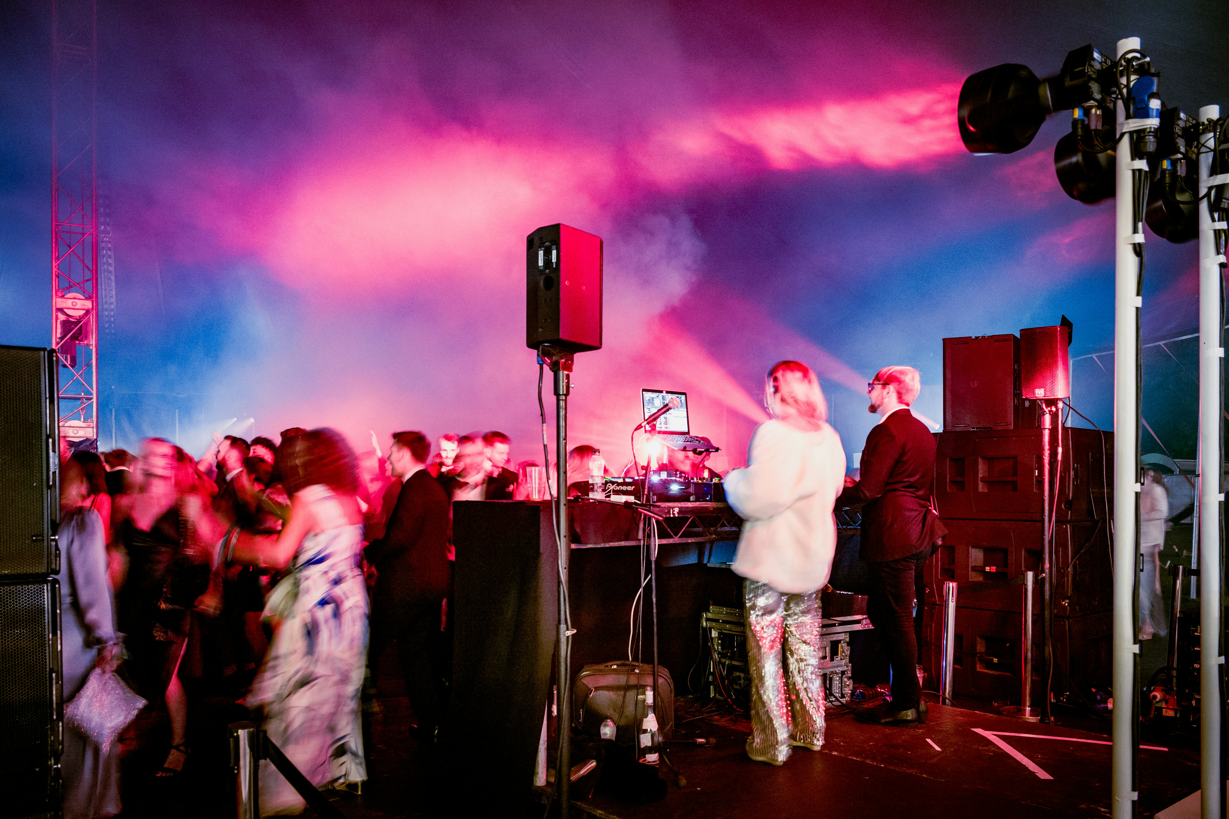 A group of people standing around a stage photo – Free Human Image on ...