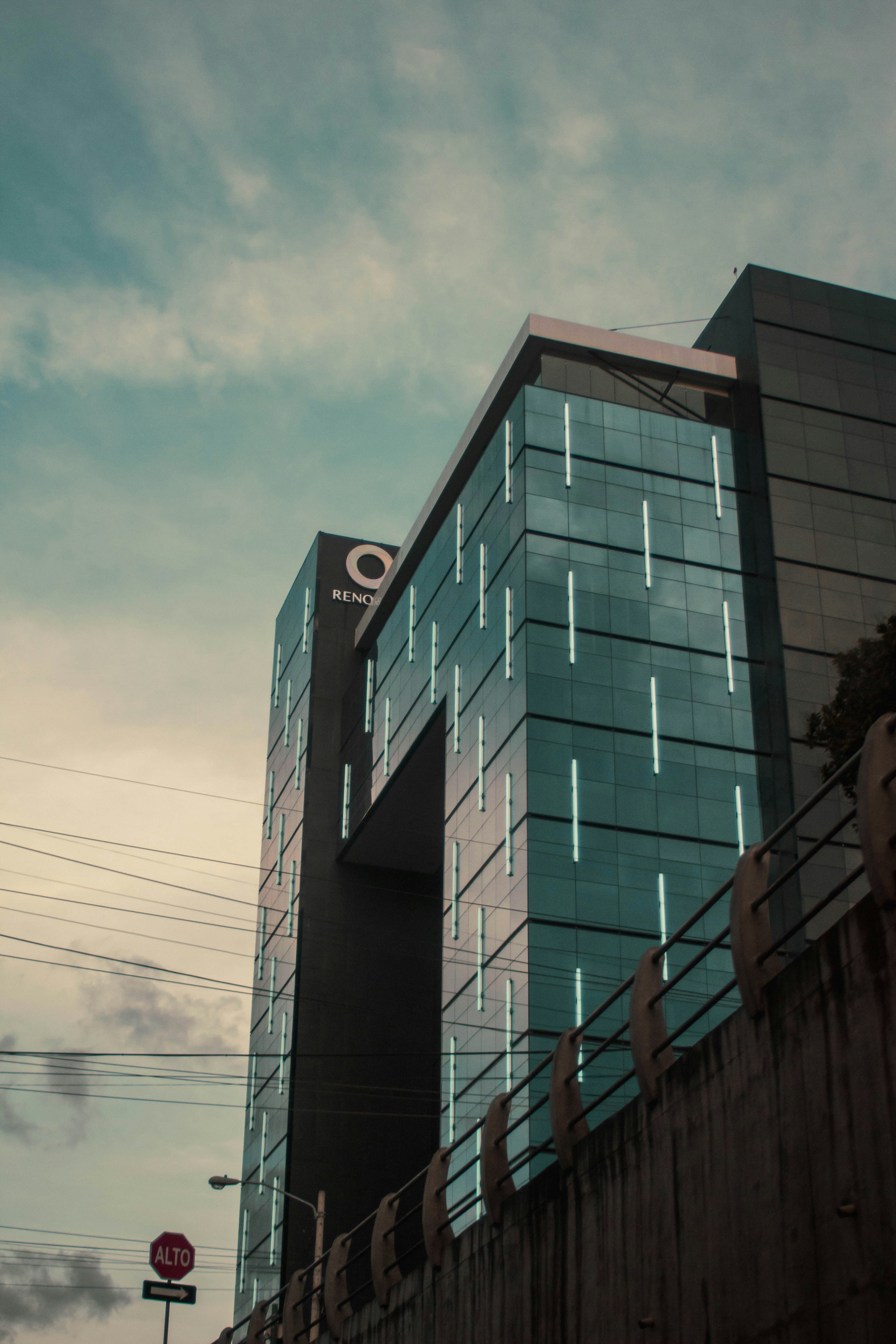 Neon-Ribbed Glass Tower at Dusk