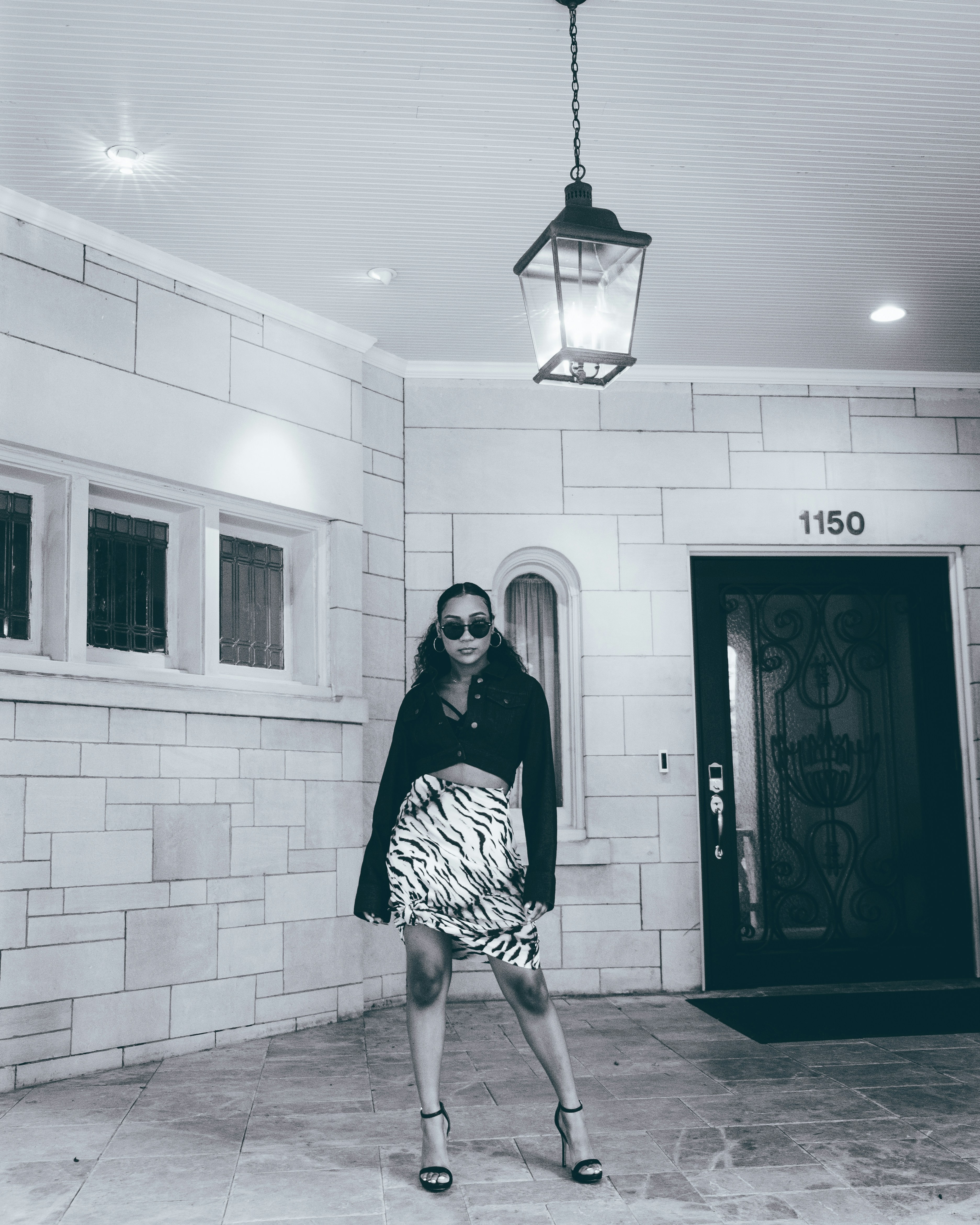 a woman standing in front of a building