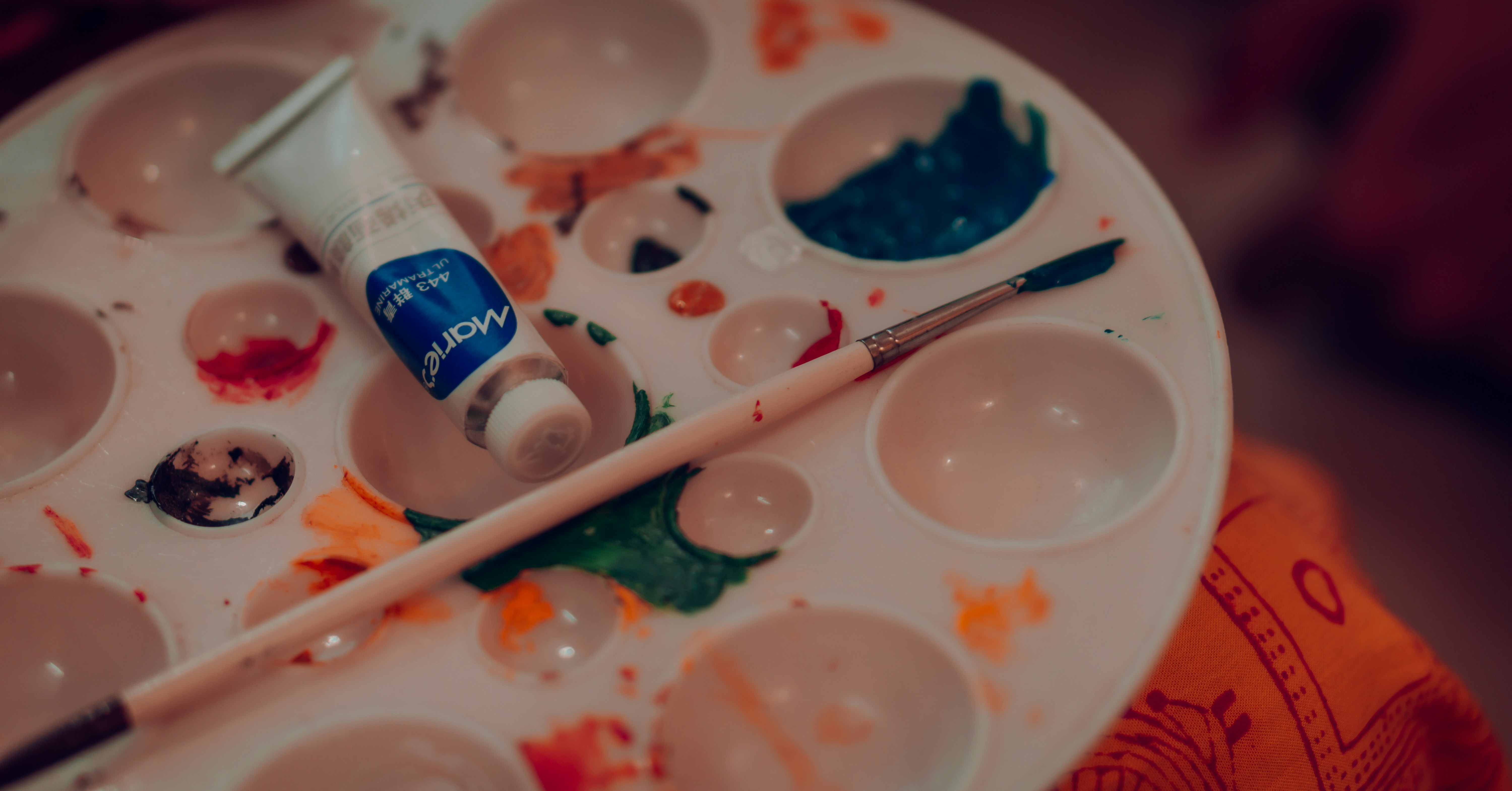 Blue Tube Among Mixed Hues: A Quiet Studio Palette Moment