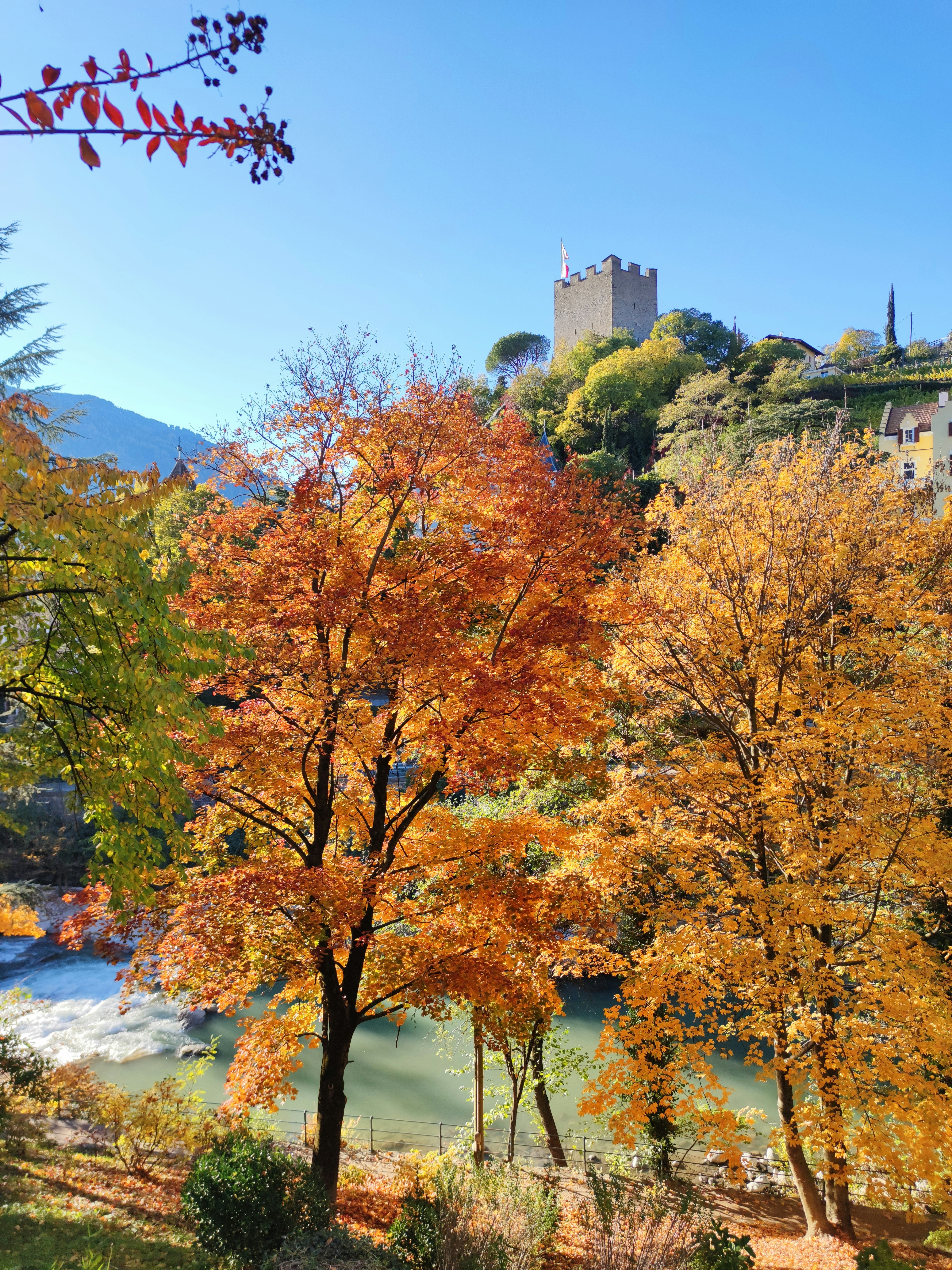 Amber Canopy Over the River: Autumn at a Hilltop Fortress