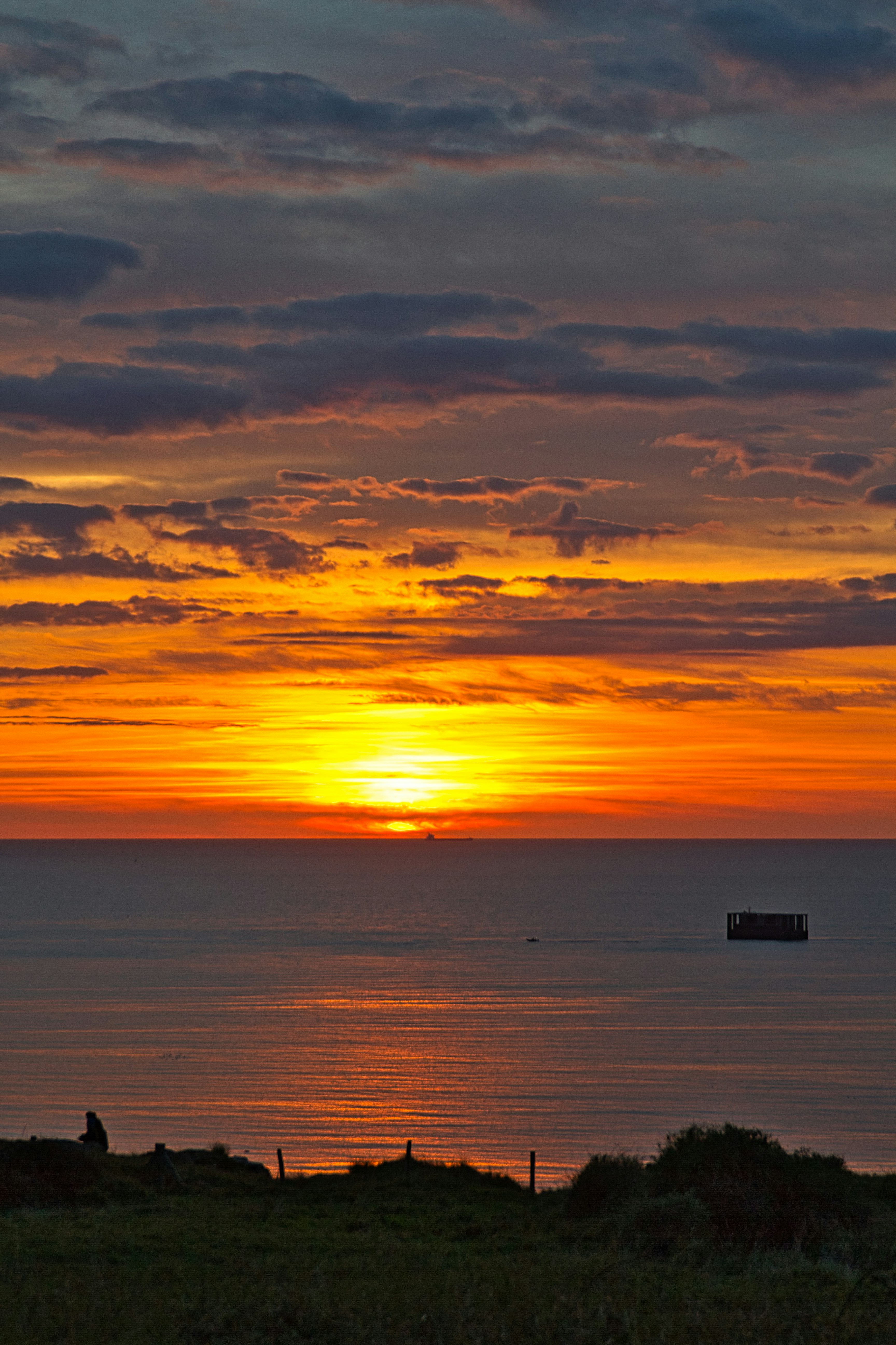 Fire at the Horizon: A Quiet Sea Sunset