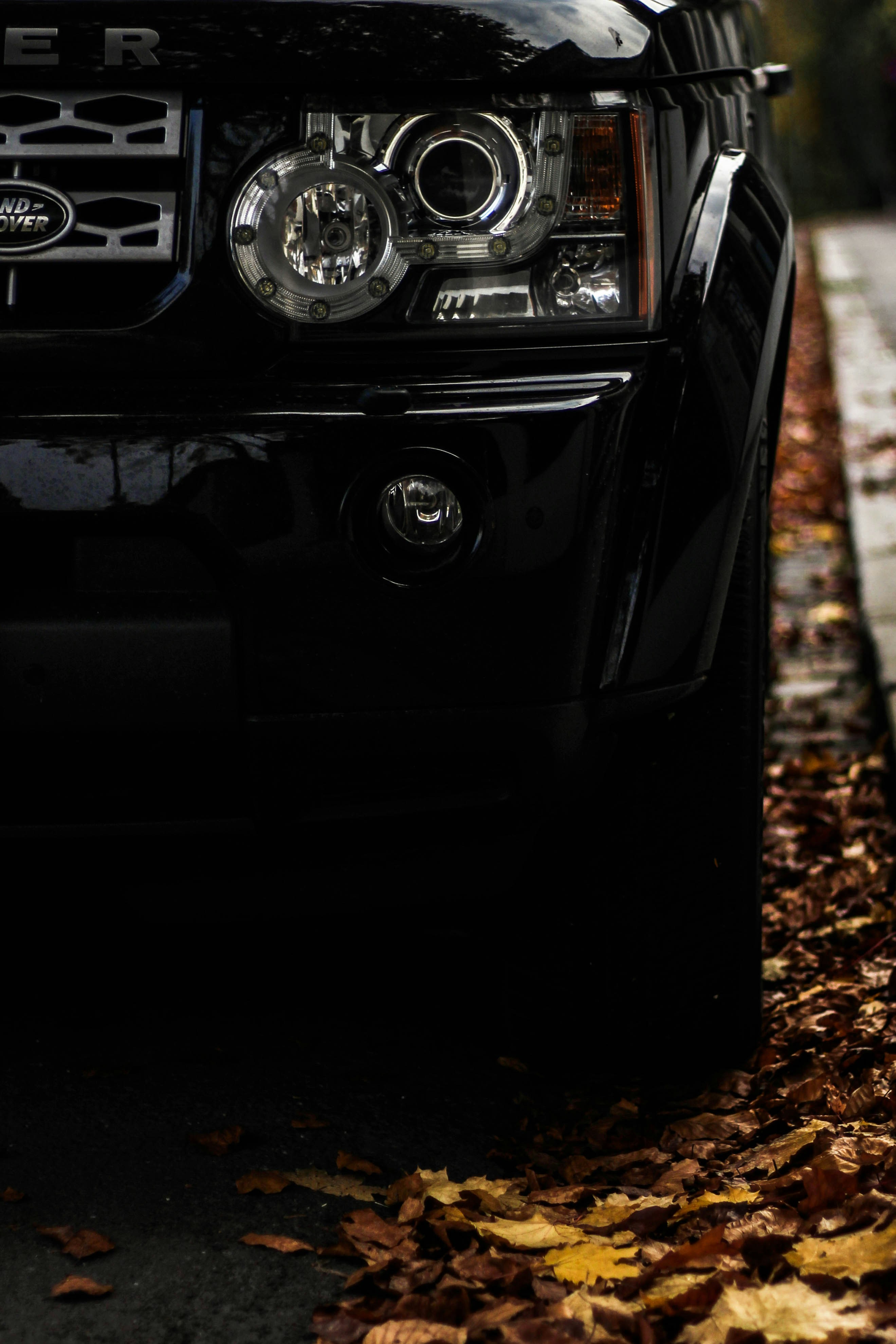 a black car parked on the side of the road