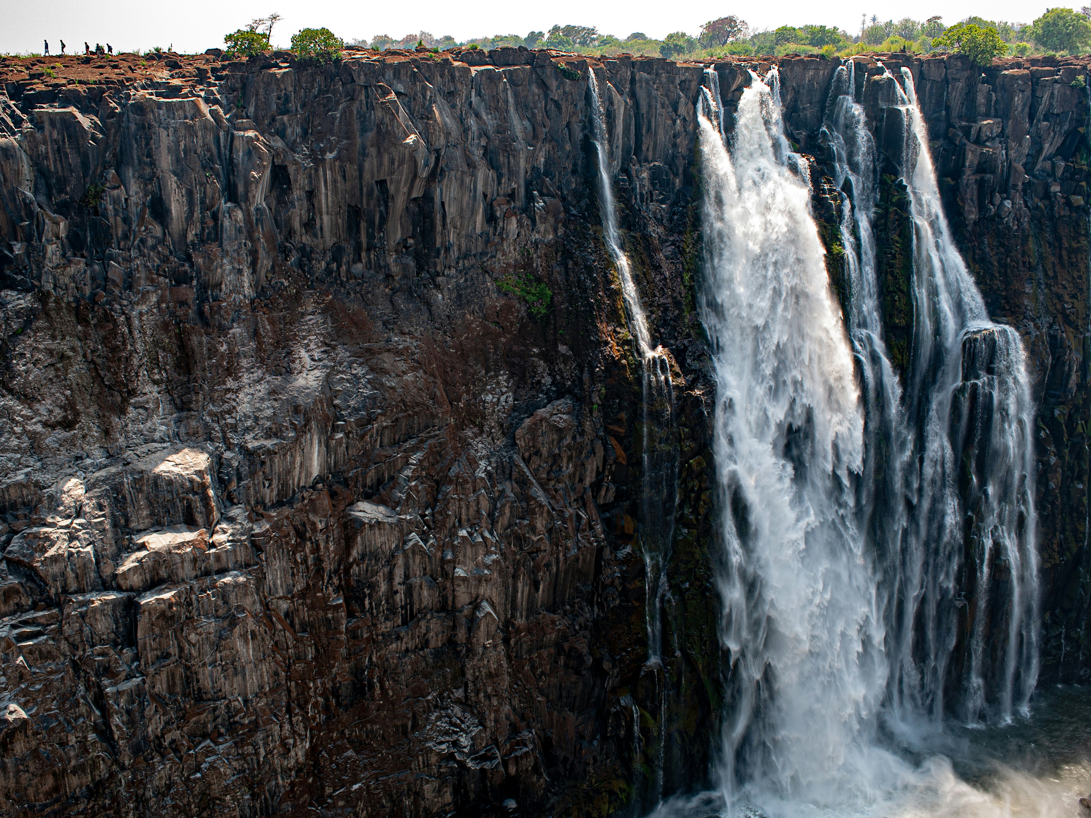 A very tall waterfall with lots of water coming out of it photo – Free ...