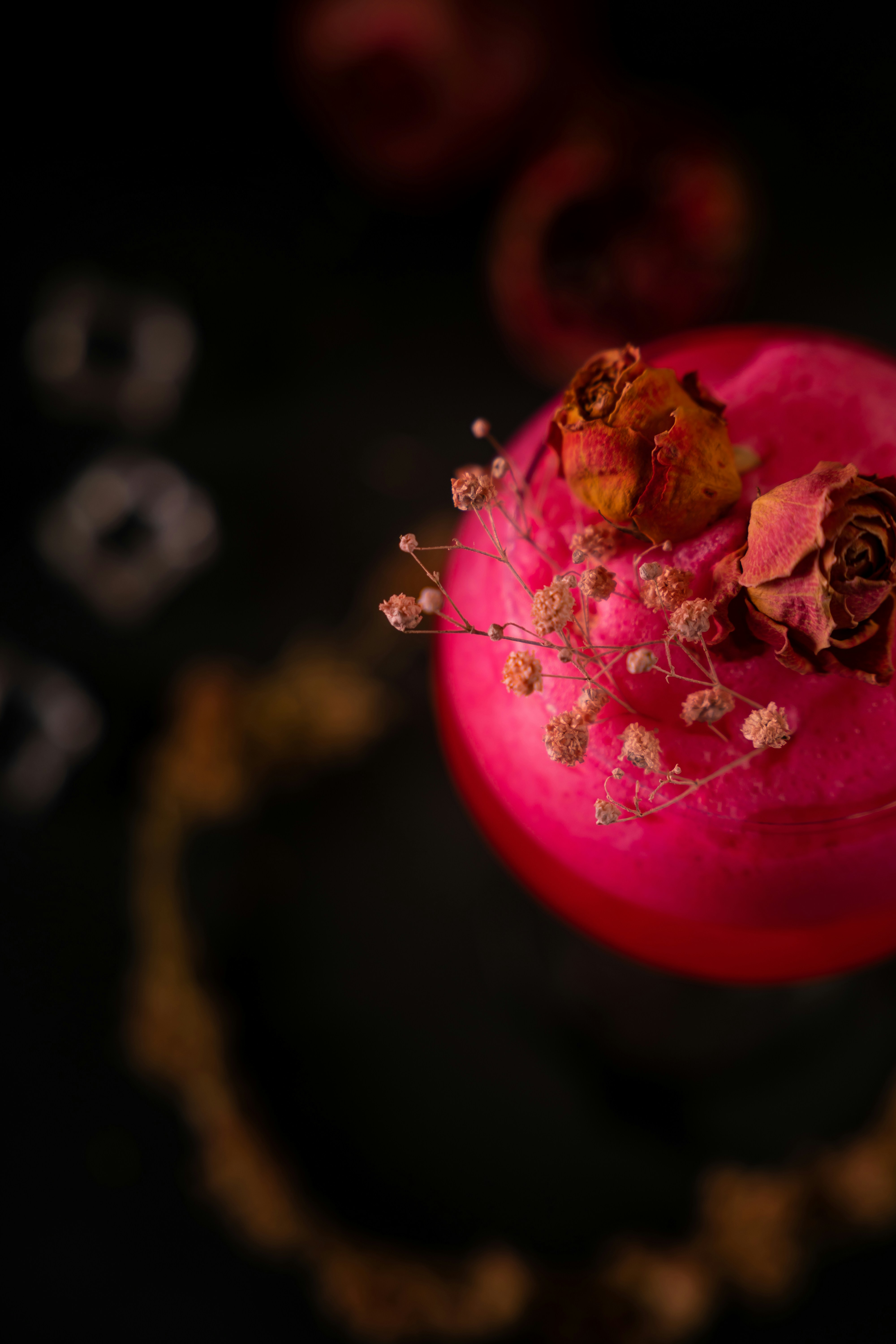 Crimson Cocoa Bloom: A Close-Up of Floral Garnish on a Velvet Dessert