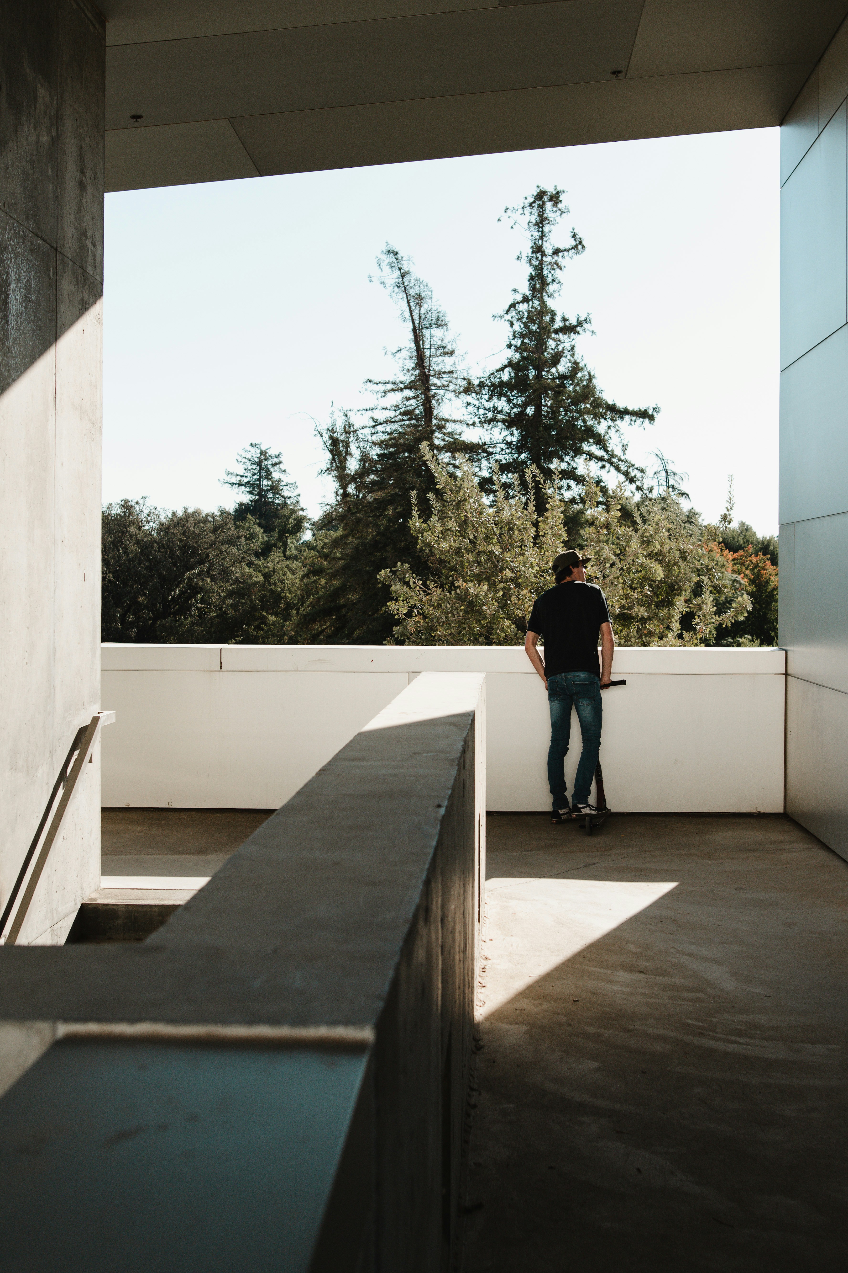 Skater at the Edge: Quiet Terrace Overlooking a Morning Orchard