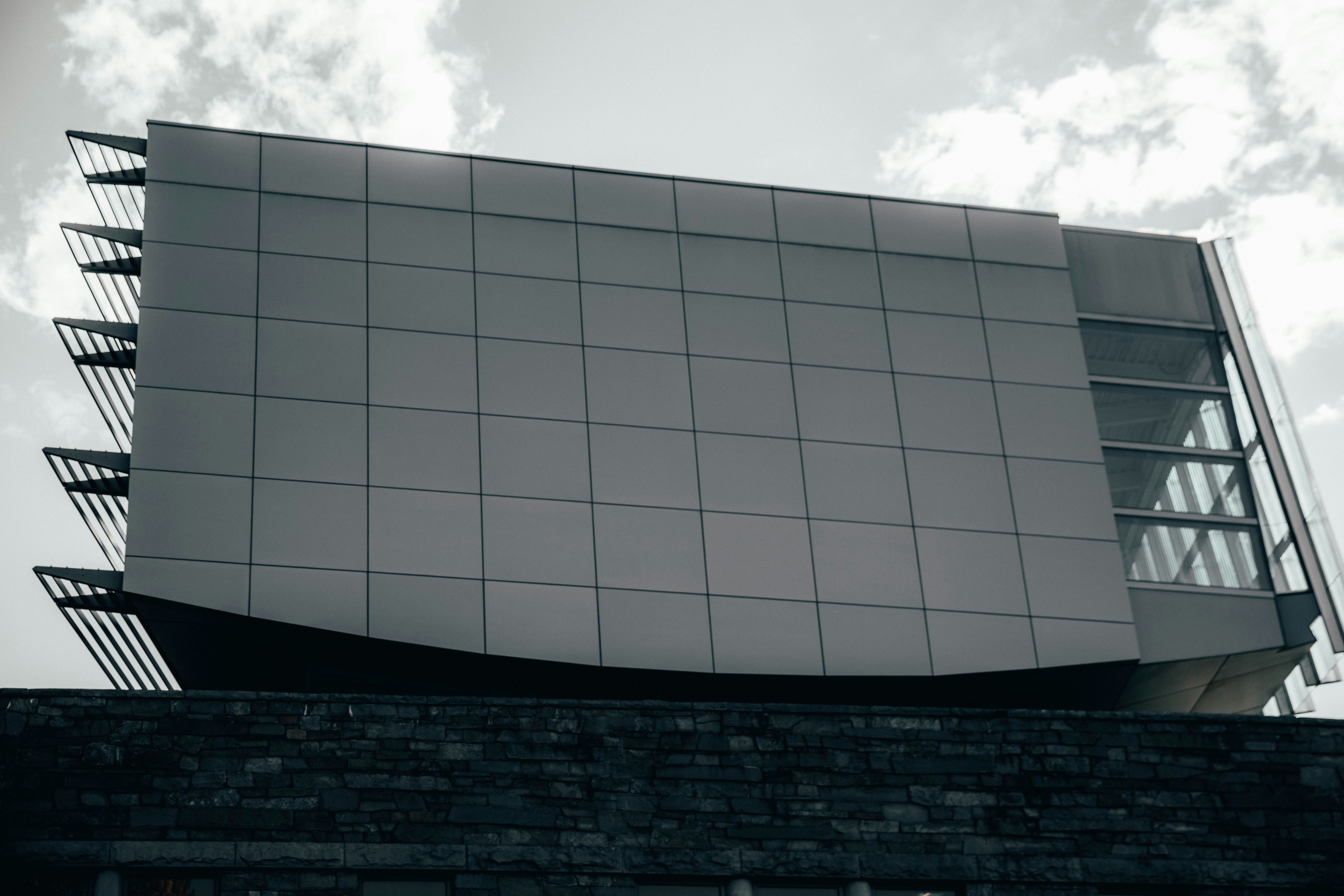 Monolithic Facade Over Brick: A Minimalist Modernist Composition