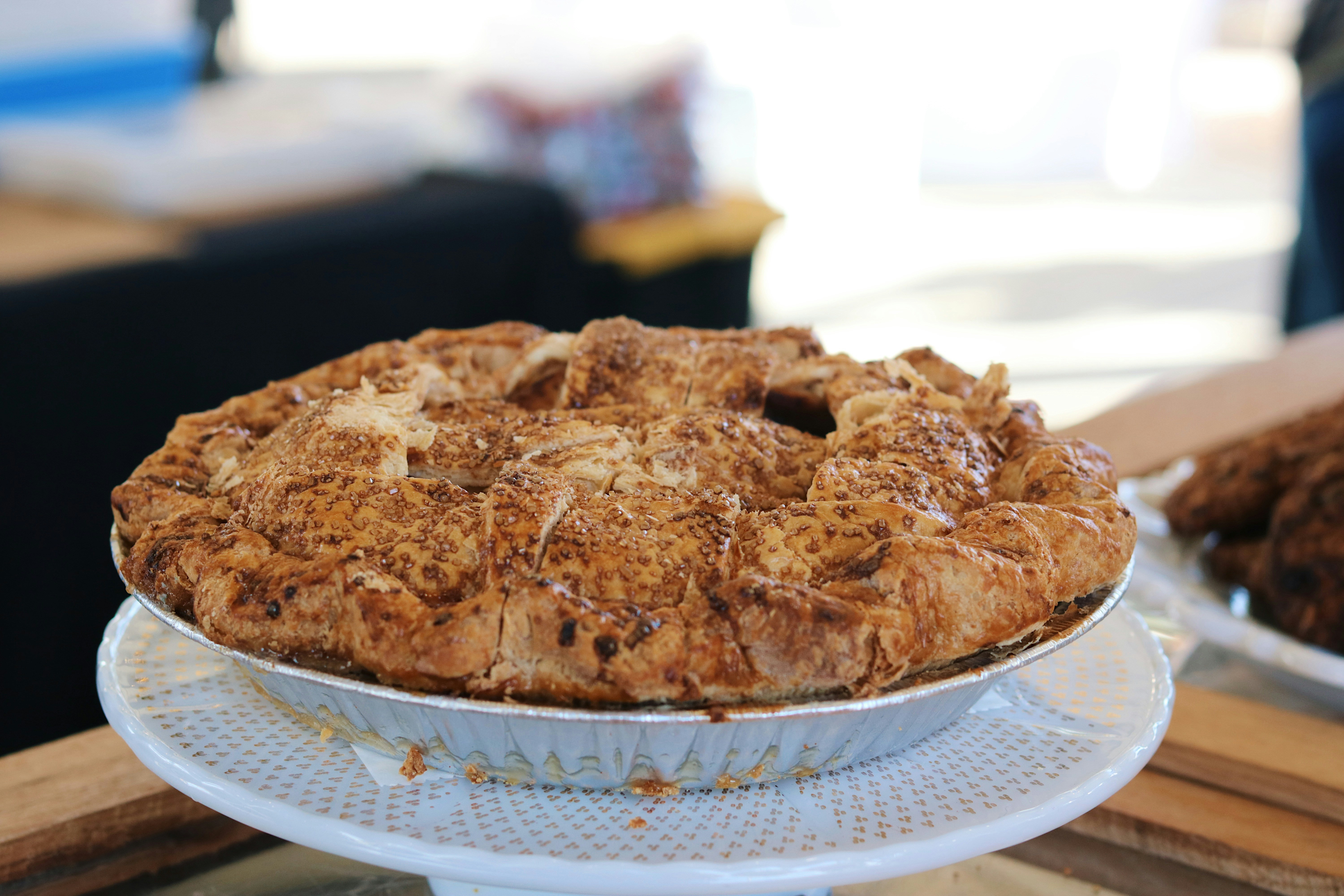 A pie sitting on top of a white cake plate photo – Free Food Image on ...