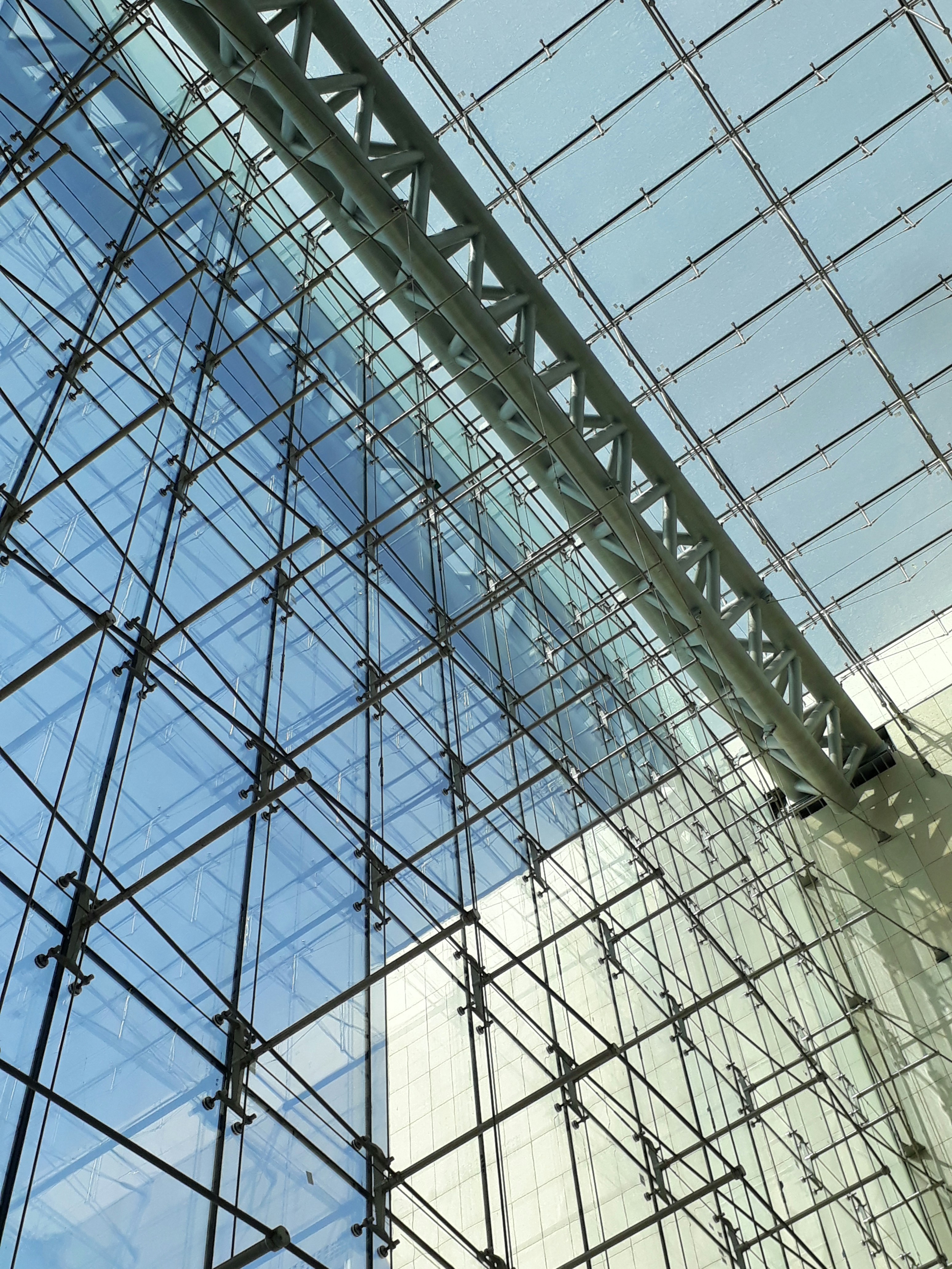 A close up of a glass and steel structure photo – Free Building Image ...