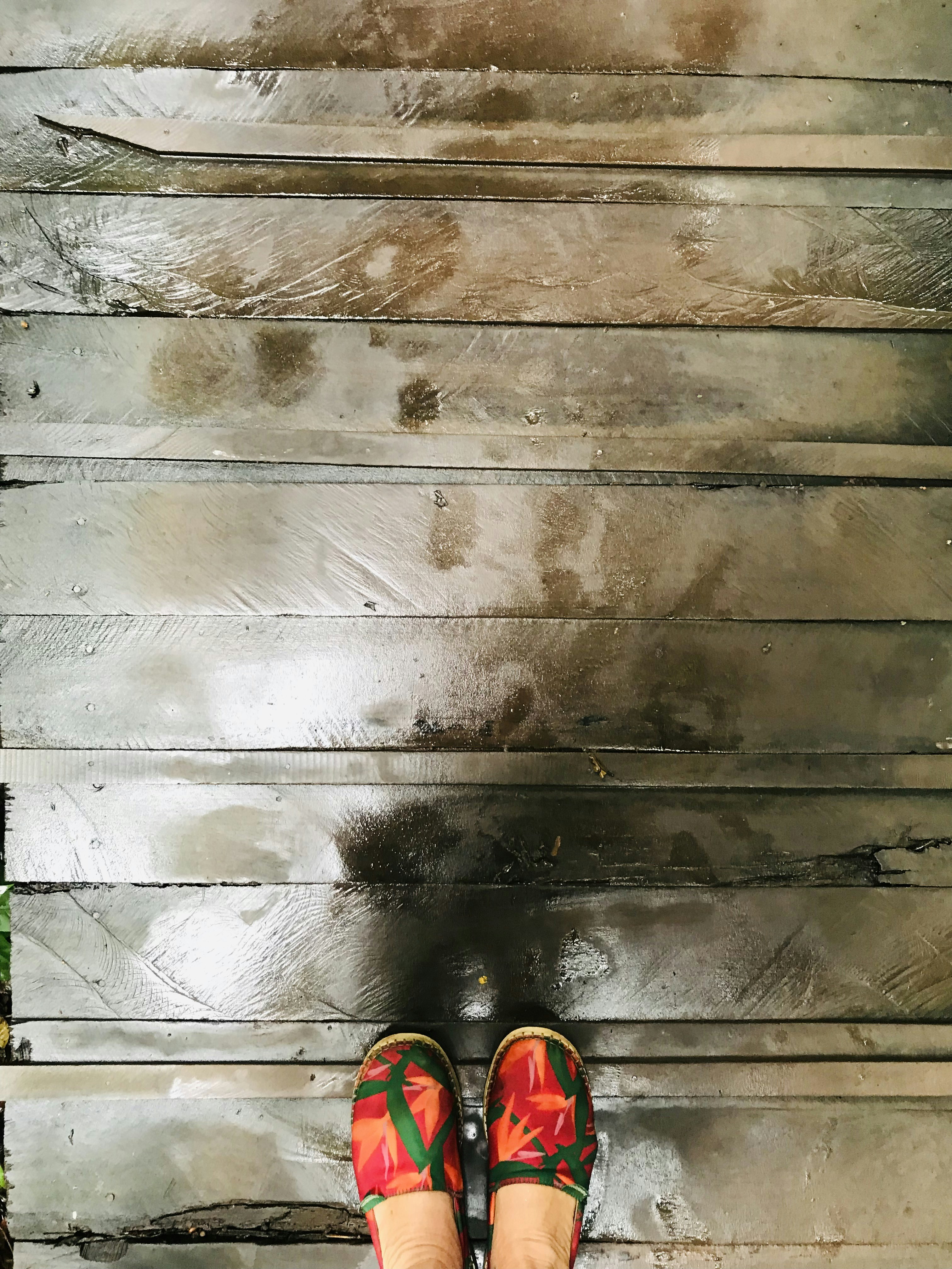 Footwear at the Edge of a Wet Boardwalk