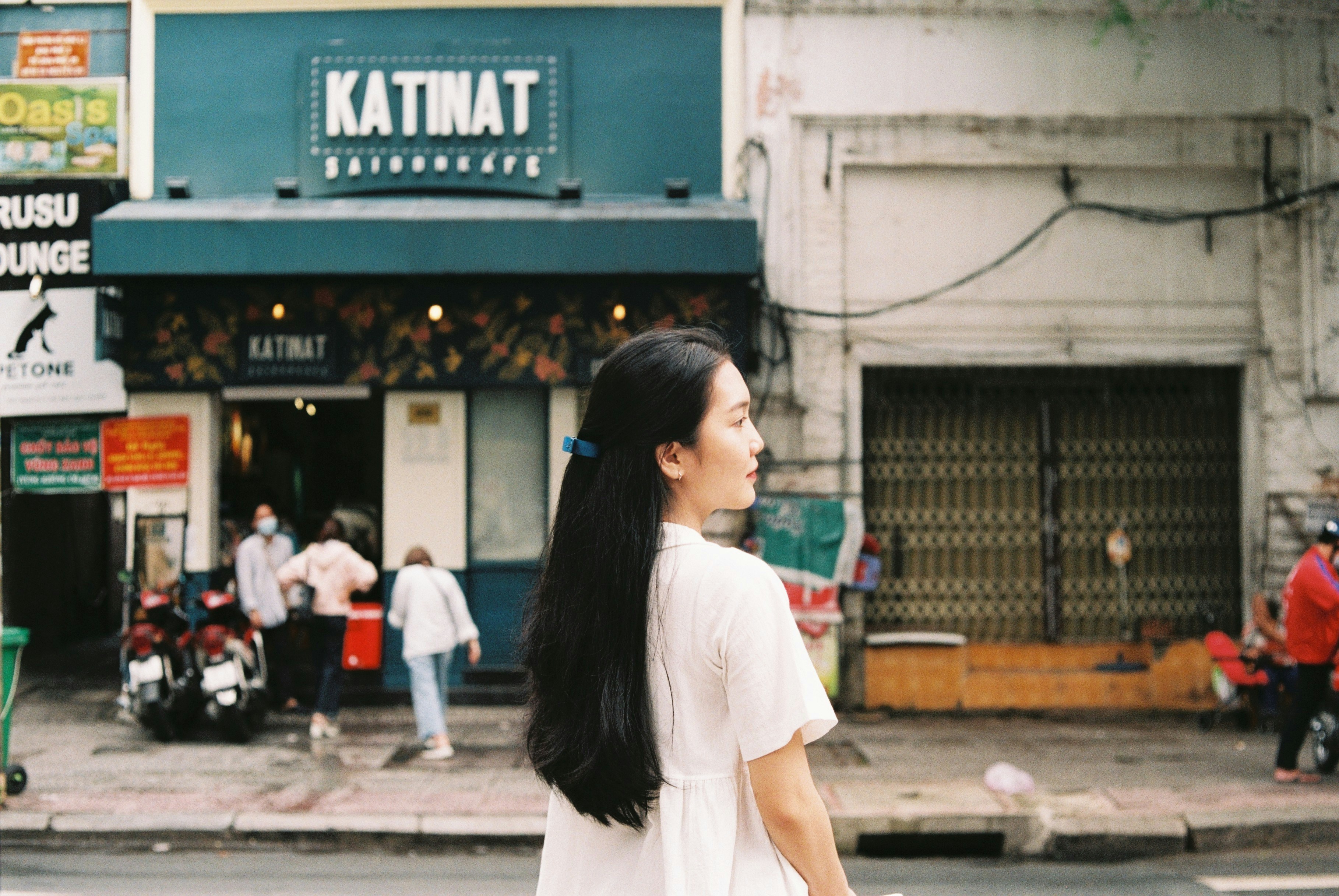 Quiet Portrait by Katnat: A Moment on a Bustling Street