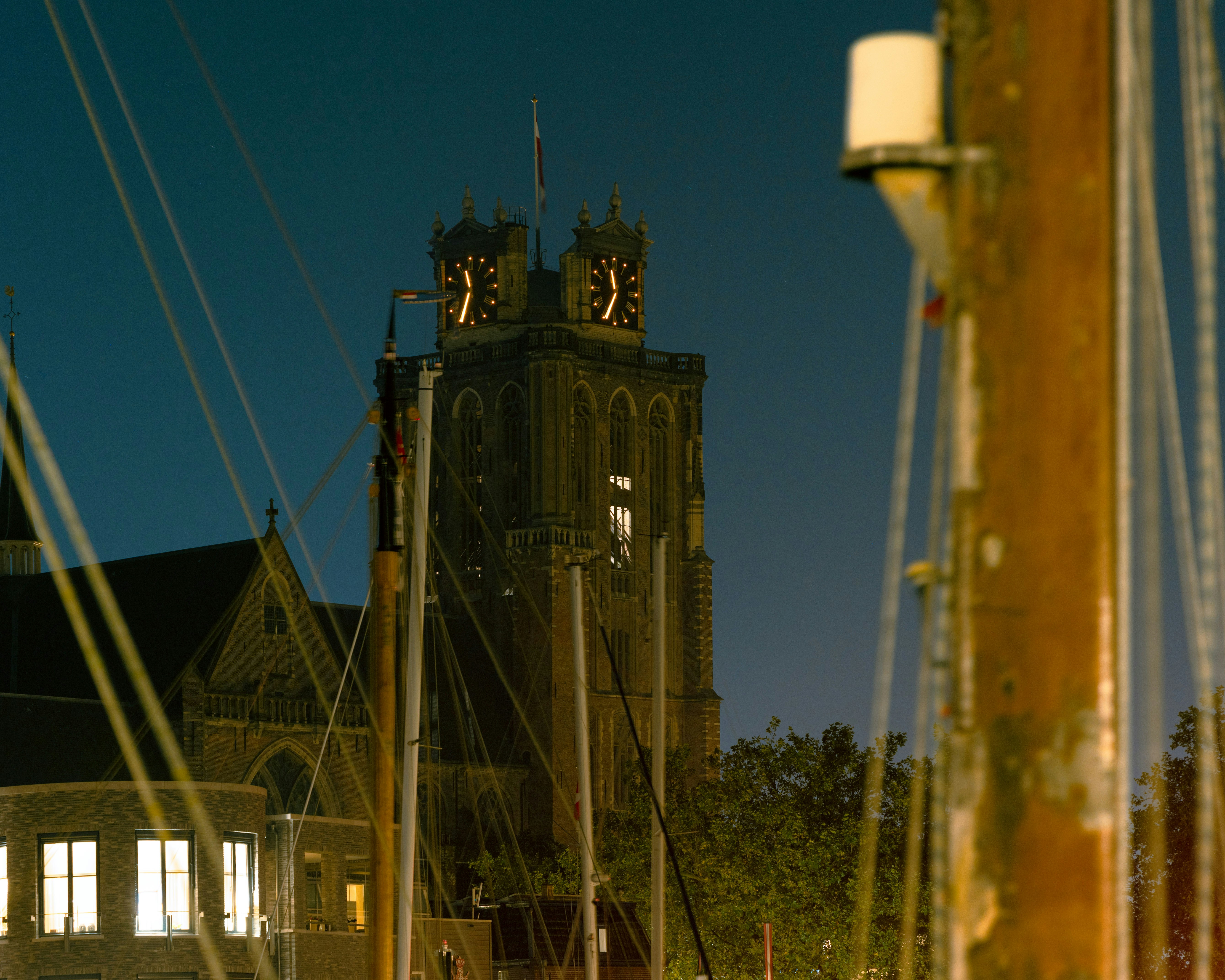 Blue Hour Clock Tower Framed by Wharf Rigging