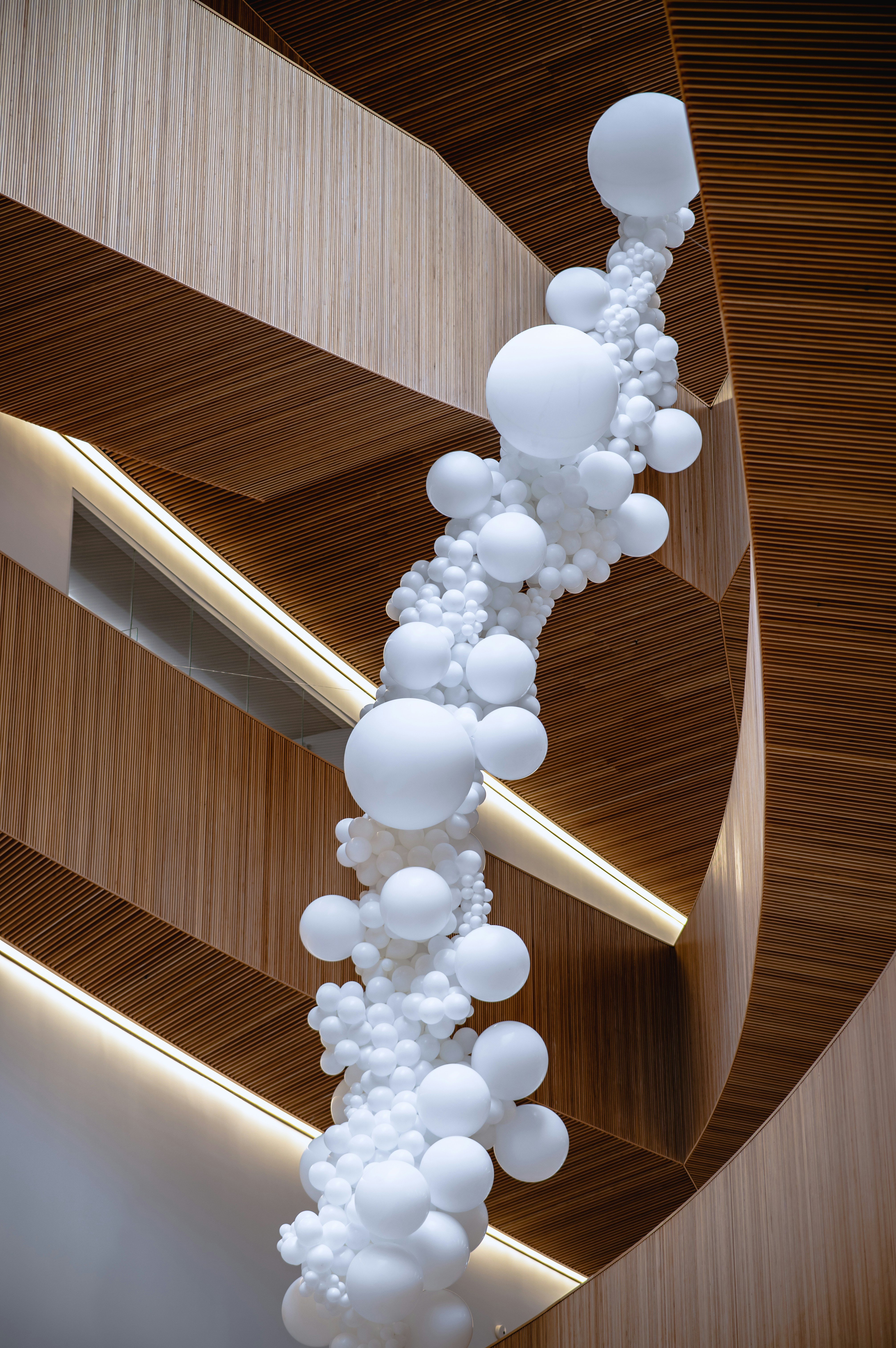 Orb Cascade in a Timber Atrium