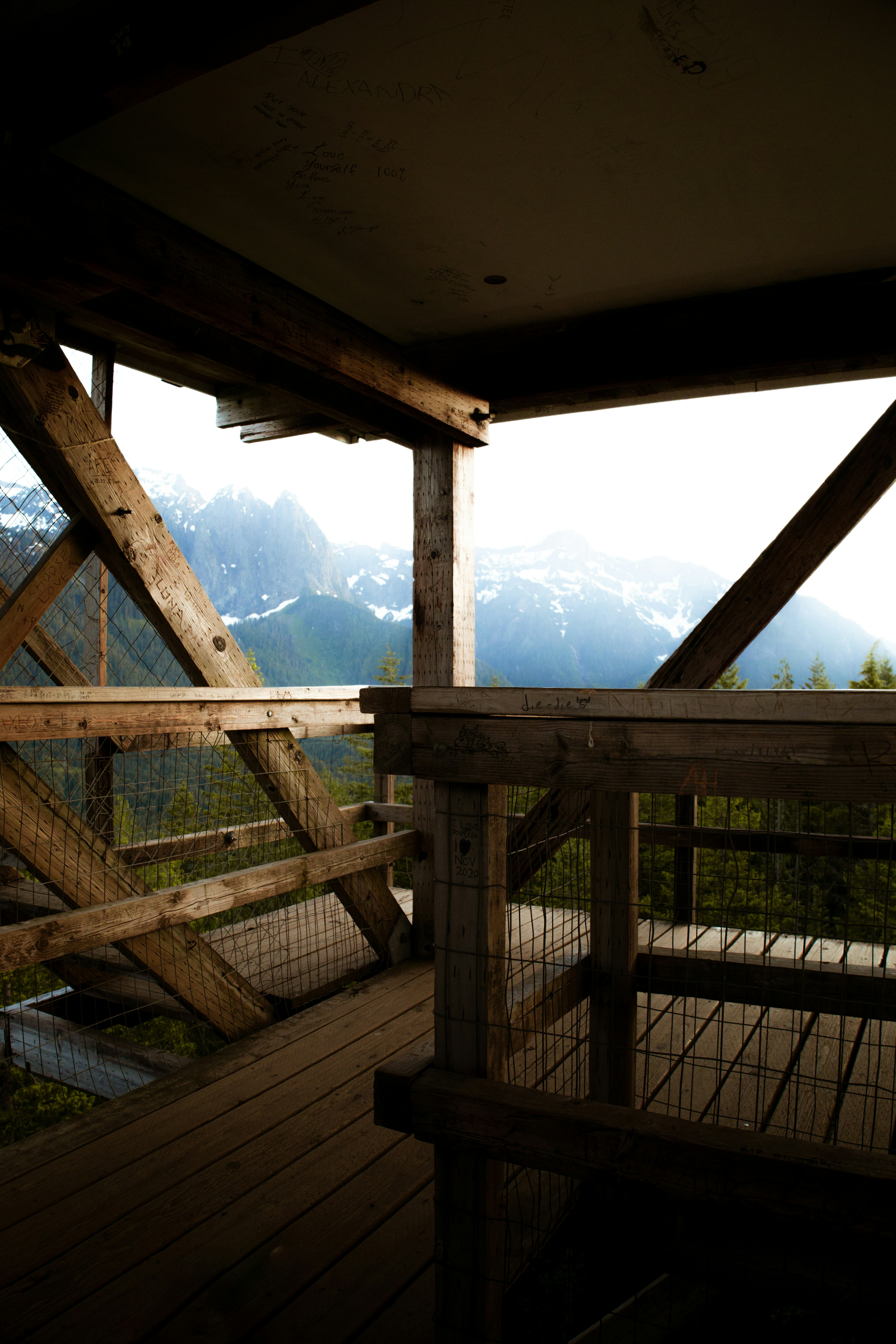 Alpine timber frame overlooking a snow-dusted valley