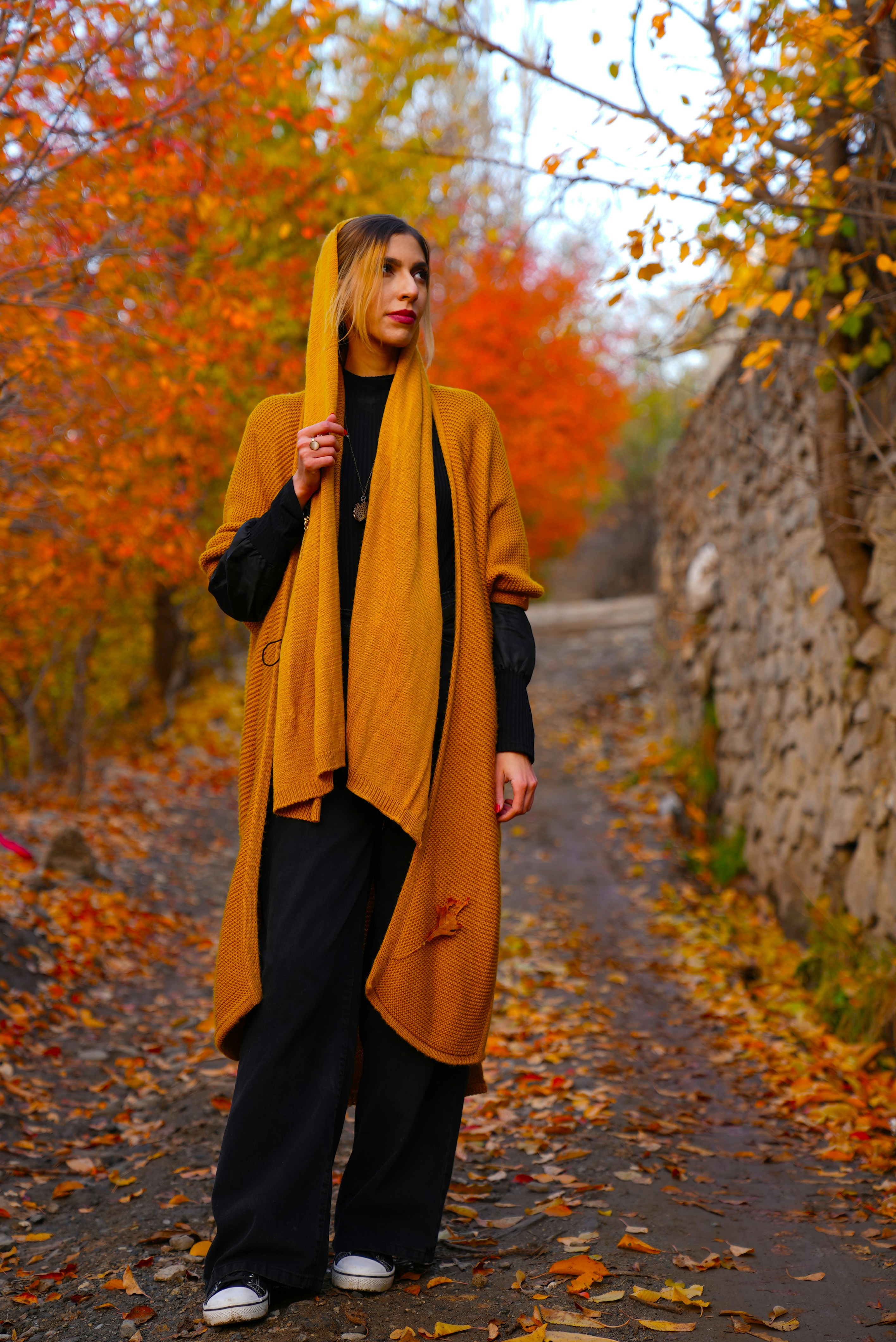 Amber Shawl on a Leaf-Littered Autumn Lane