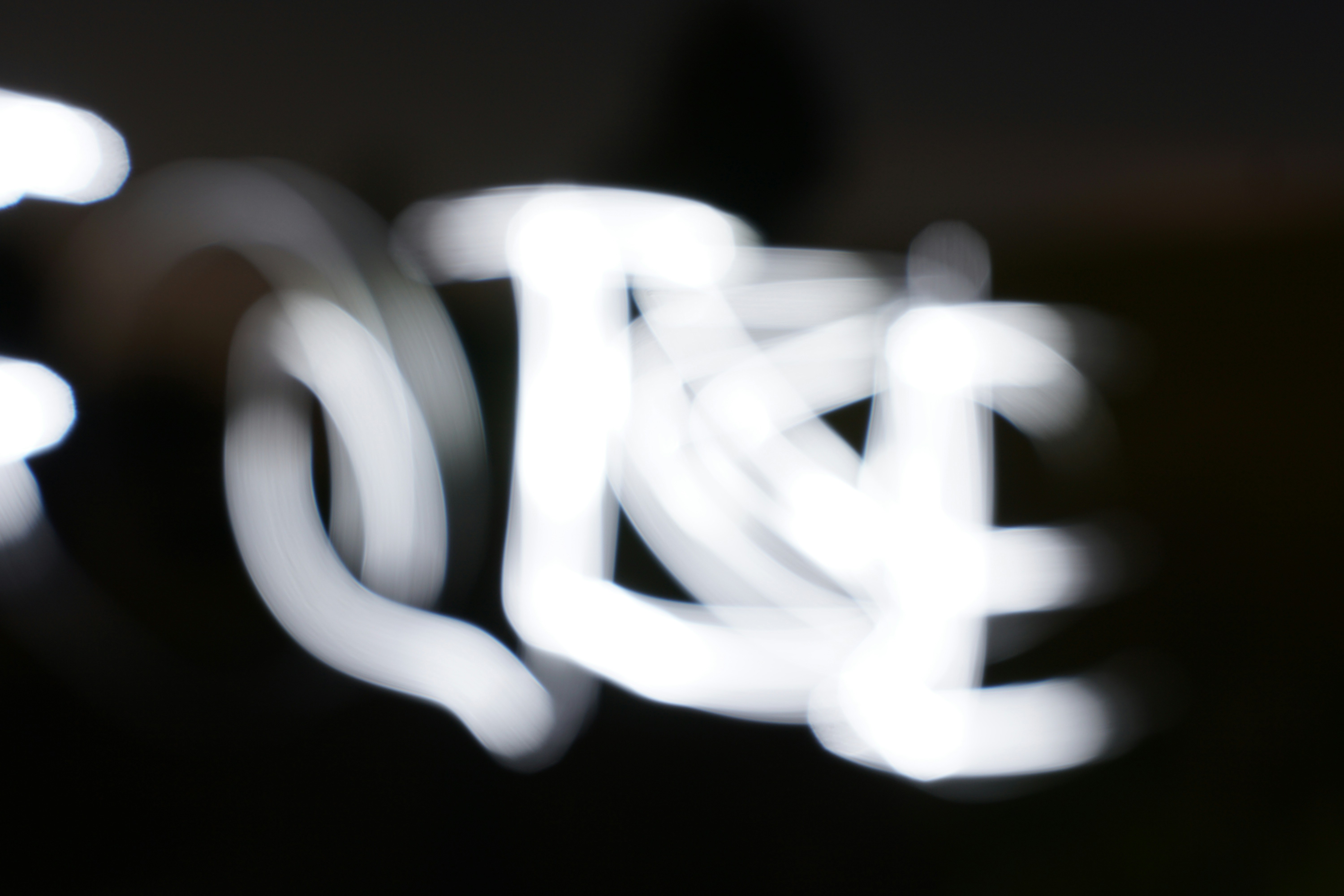 A blurry photo of a white object in the dark photo – Free Black ...