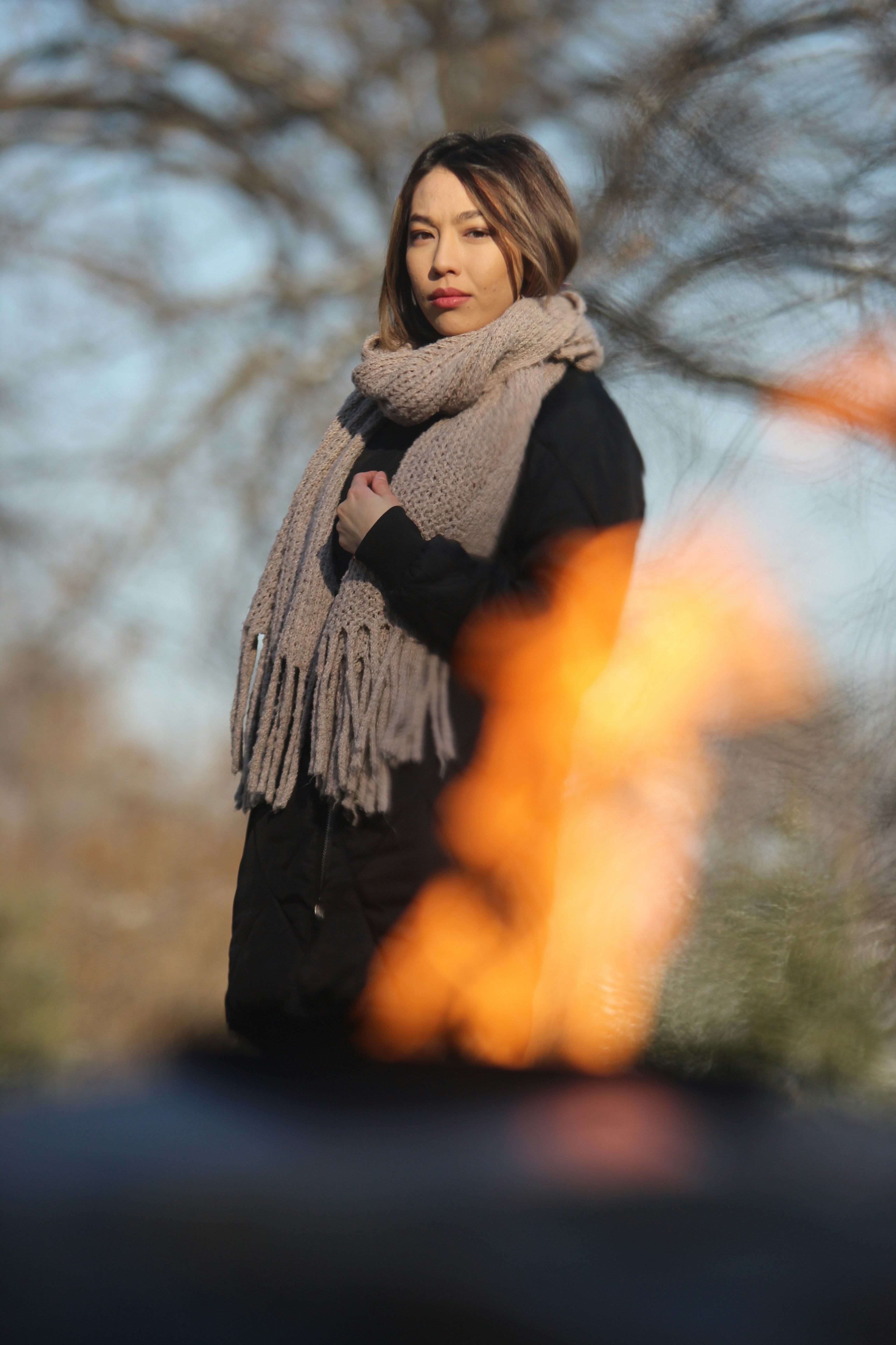A Kazakh girl stands by the eternal fire at the war memorial in Gorky park in Almaty, Kazakhstan
