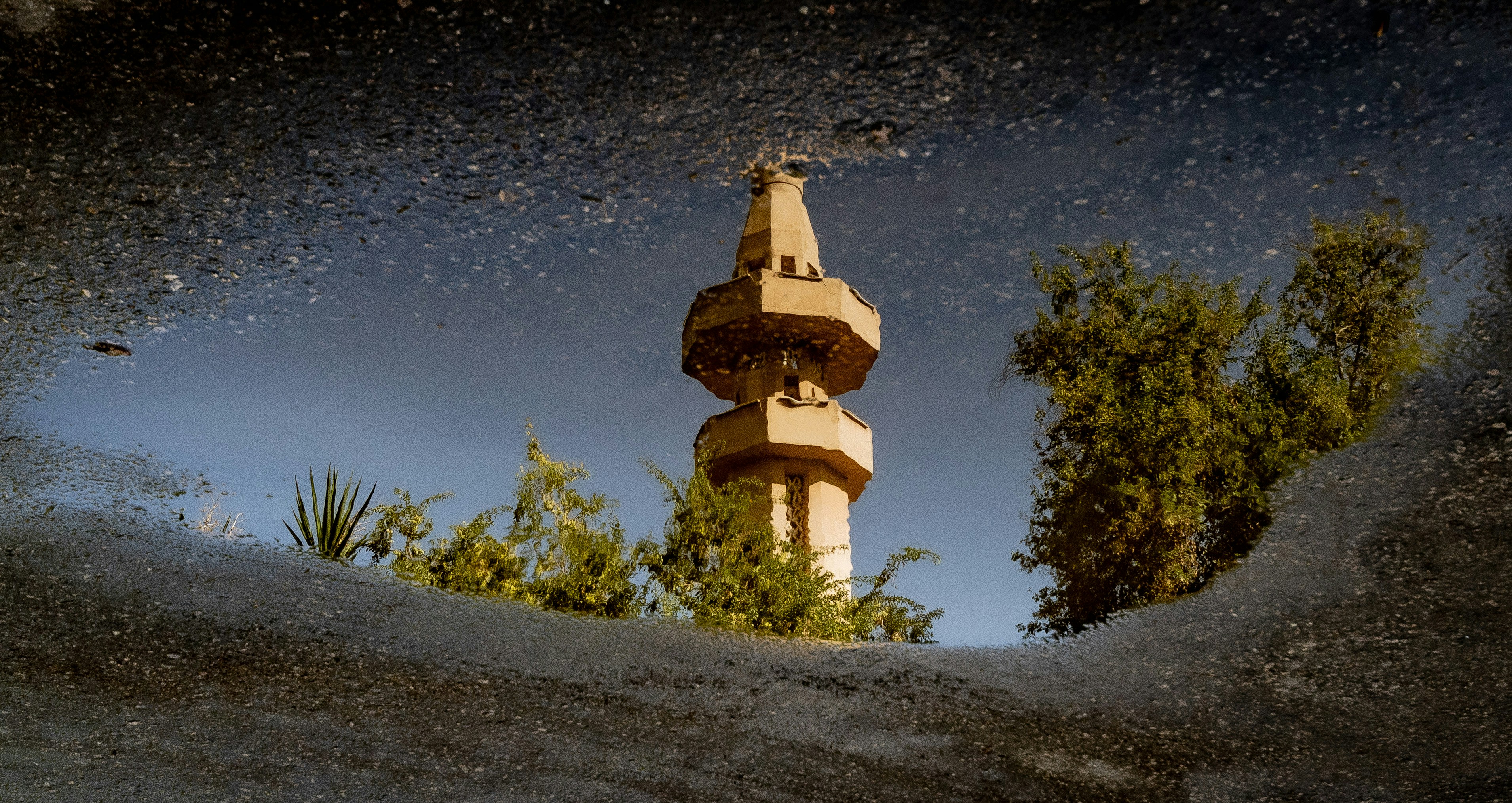 Mirror Pagoda: A Puddle Reflection of Stone Silhouette