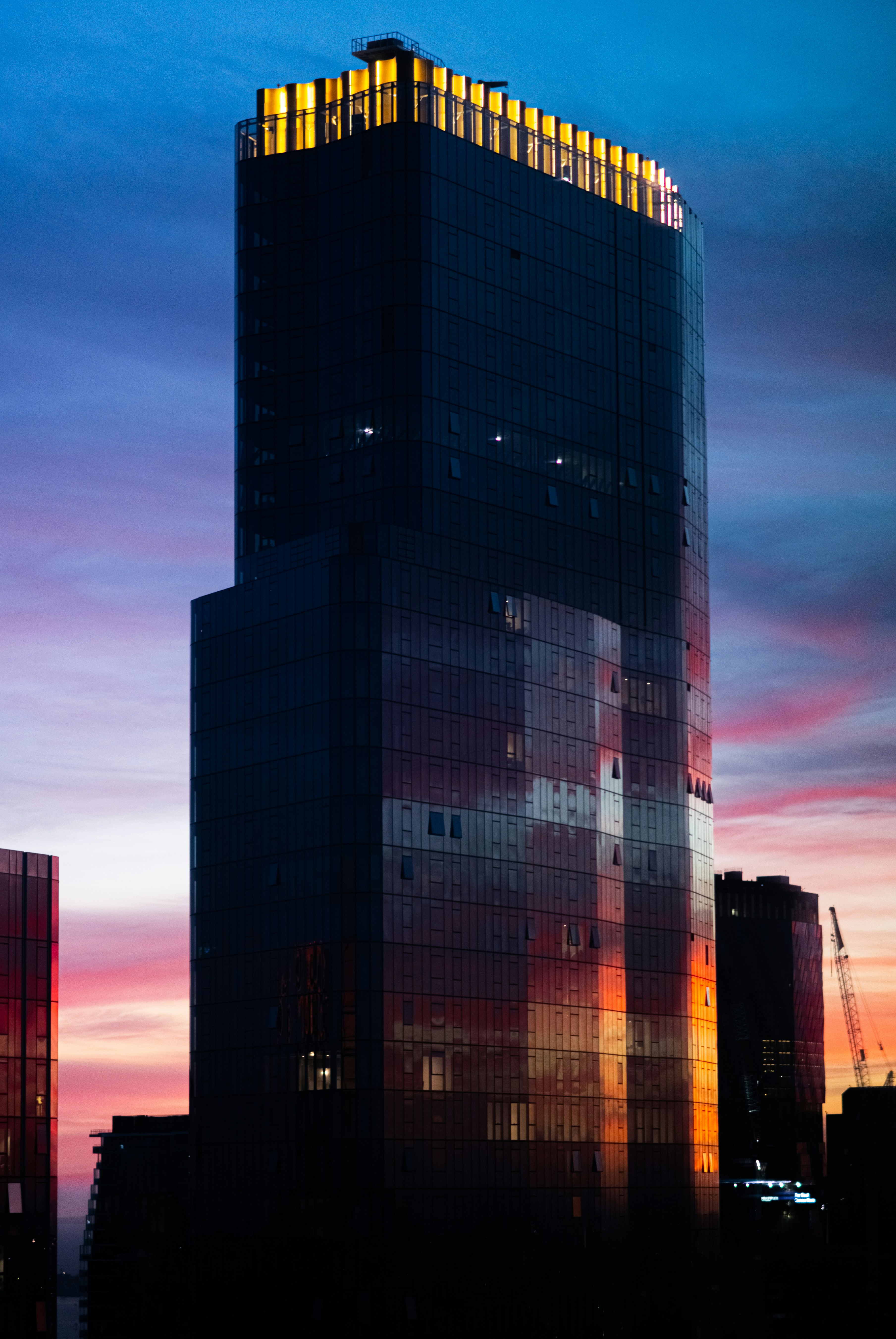 A very tall building with a lot of windows on top of it photo – Free ...