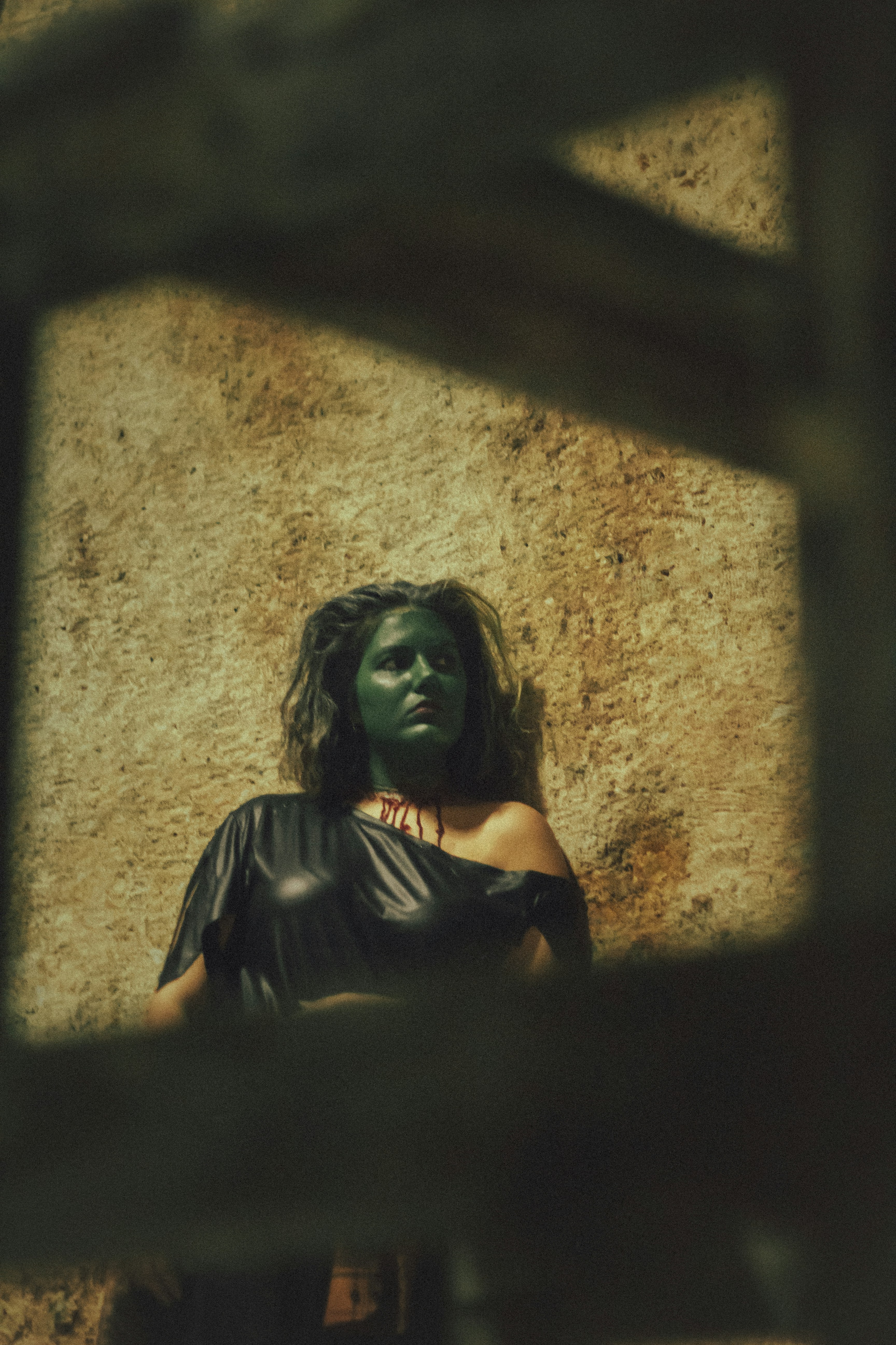 Emerald Gaze Through a Shattered Window