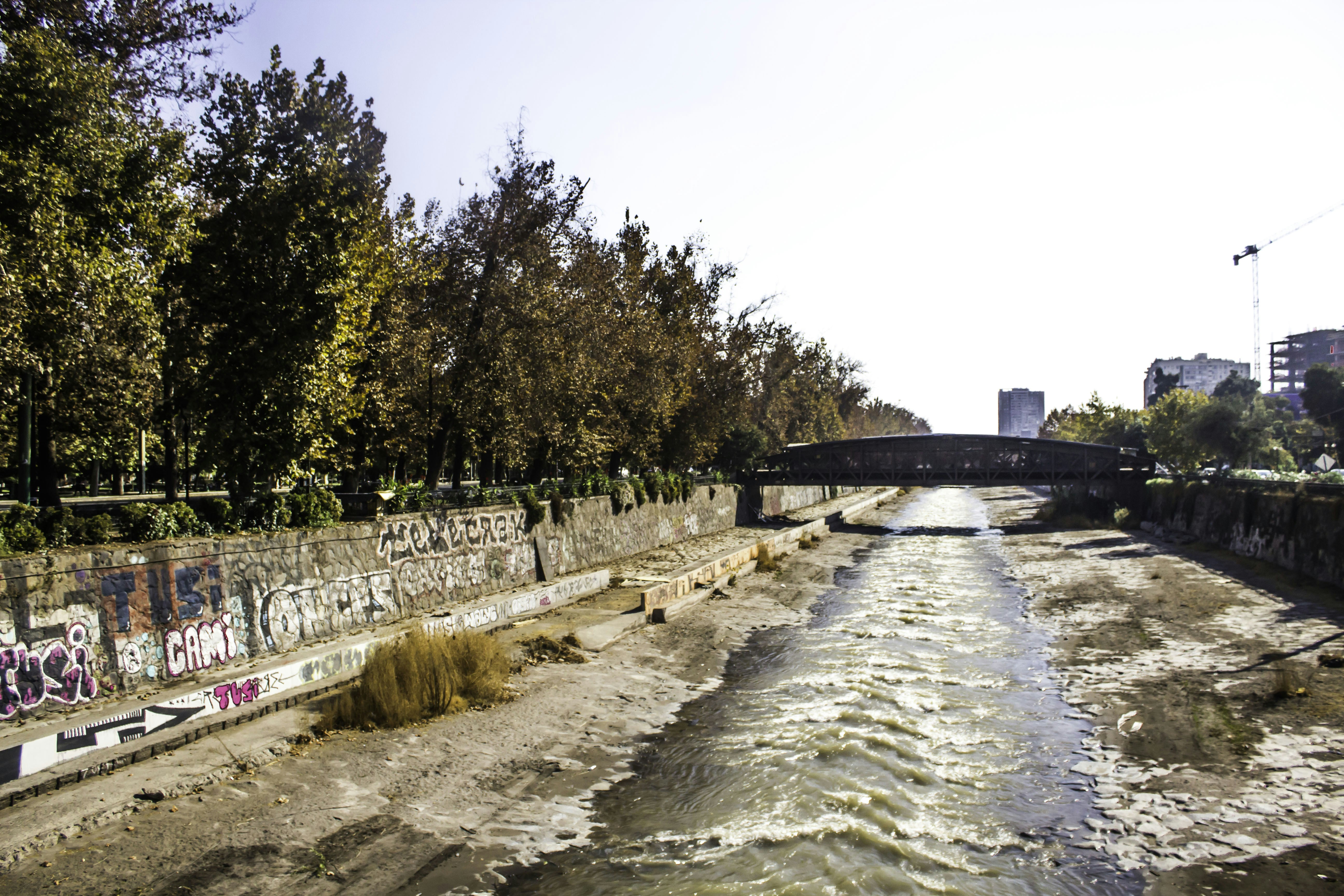Graffiti Canal: A Bridge Waits Over Choppy Water