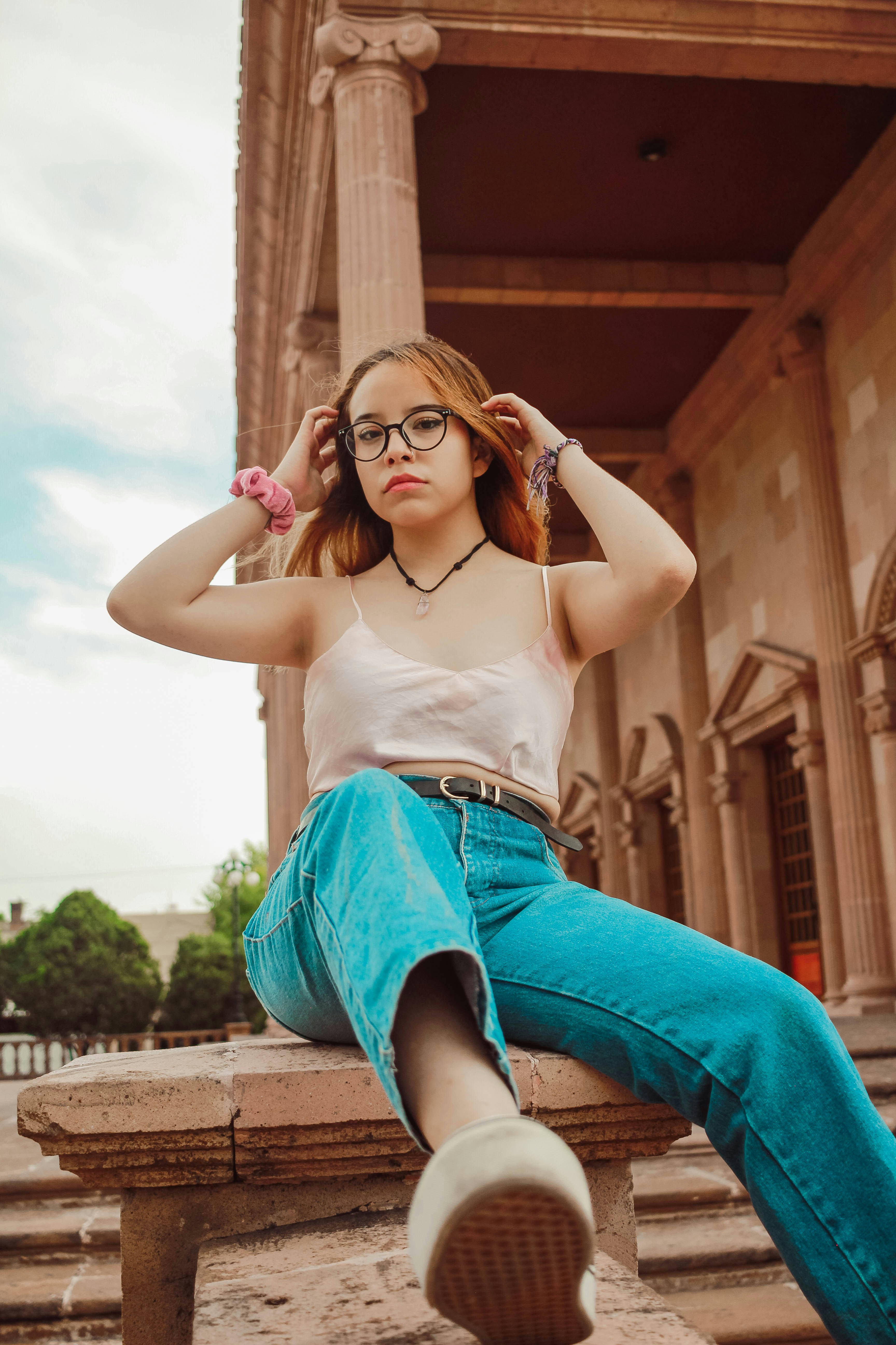 Colonnade Portrait: Quiet Confidence on Sunny Steps