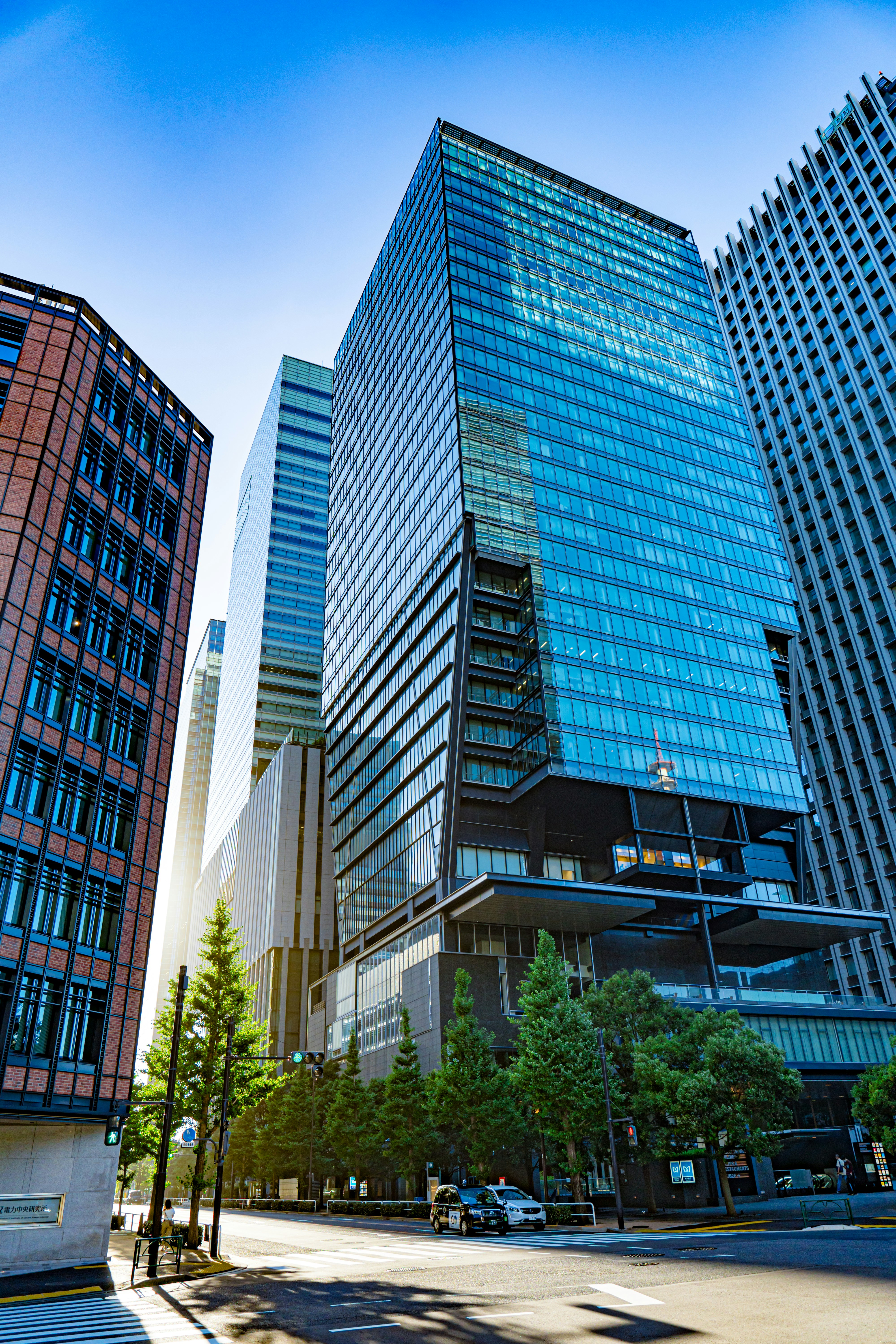 Tall buildings of Tokyo. | a group of tall buildings sitting next to each other