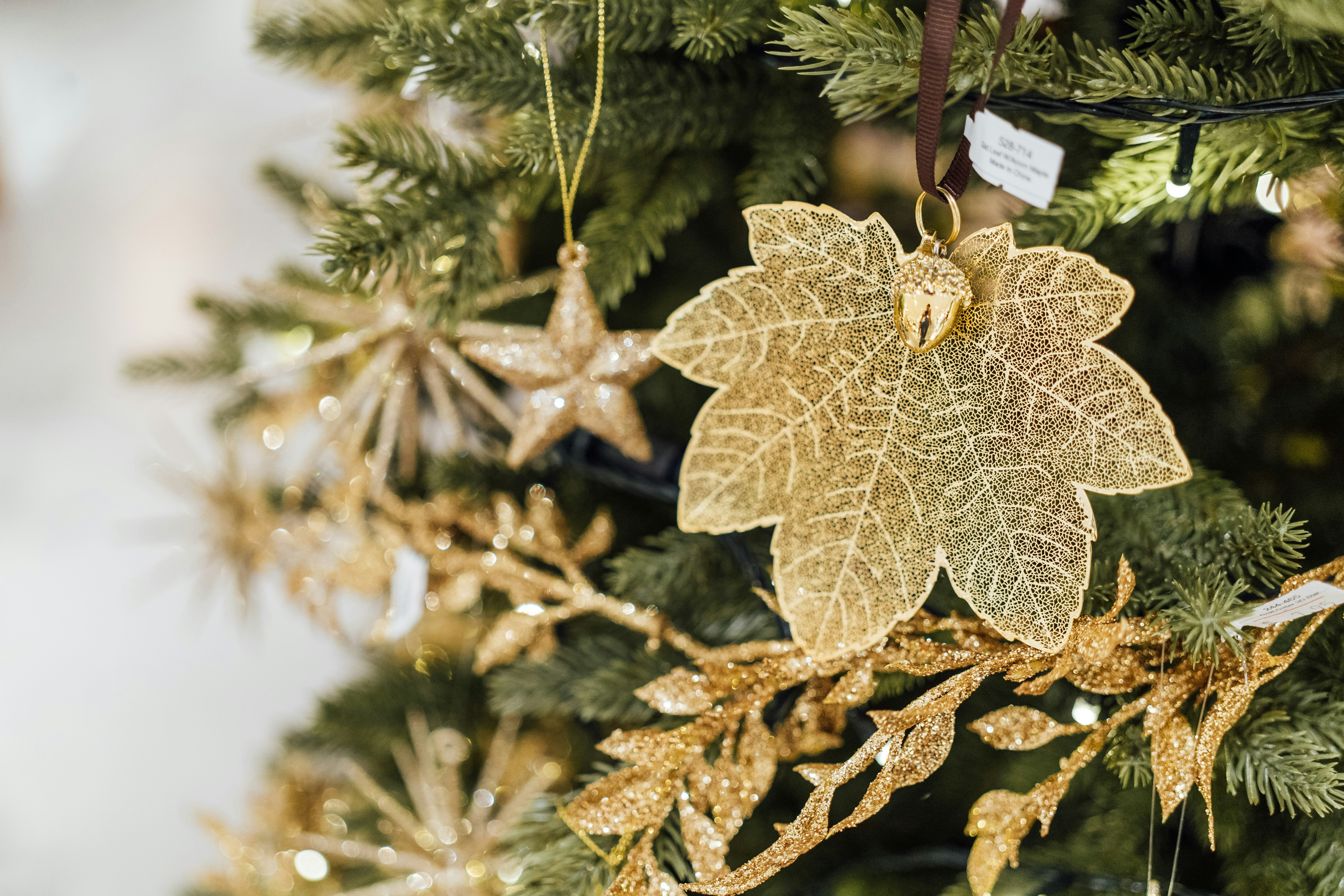 Golden Maple Leaf Ornament in a Glittering Christmas Display