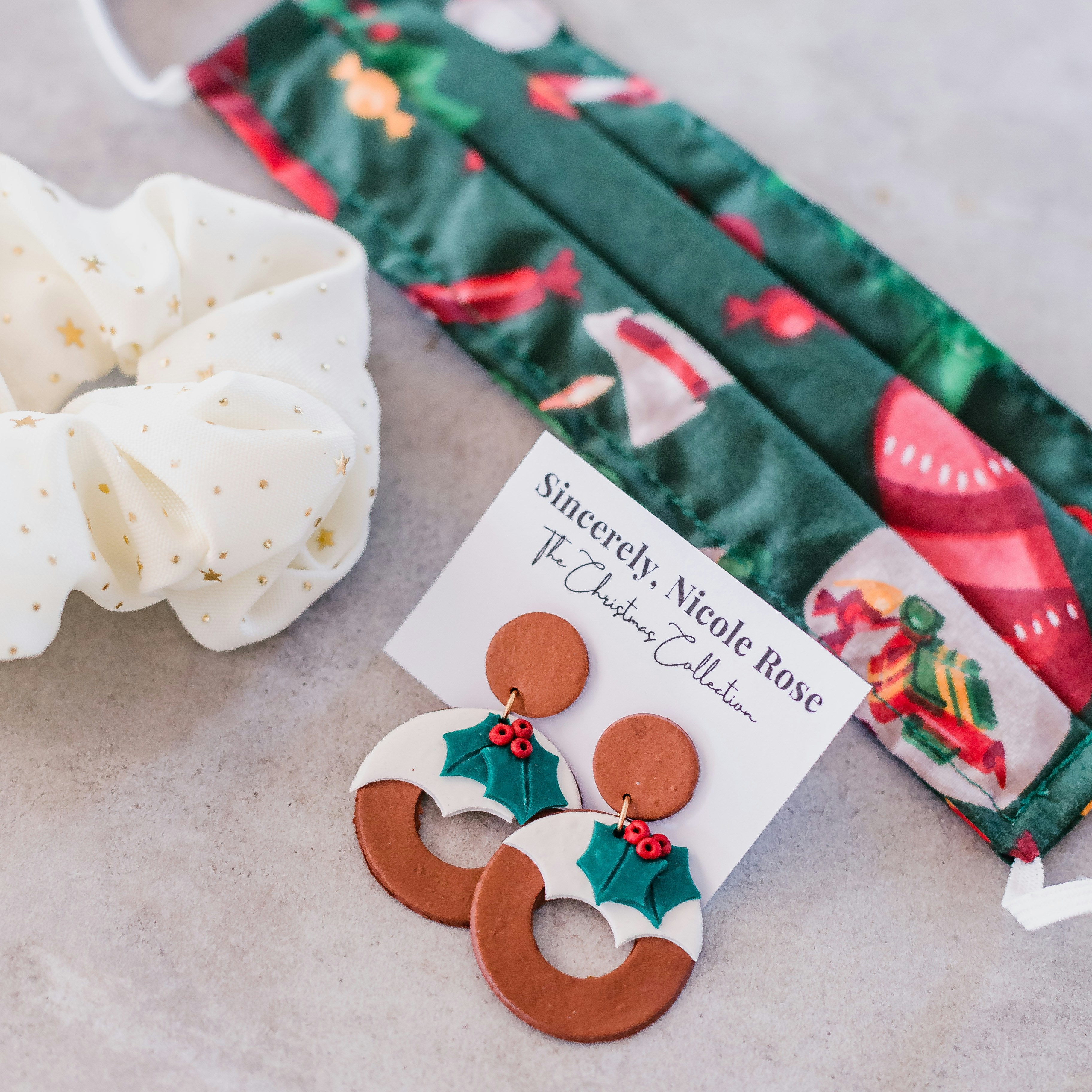 Holly Dangles on a Card: Festive Jewelry Close-Up