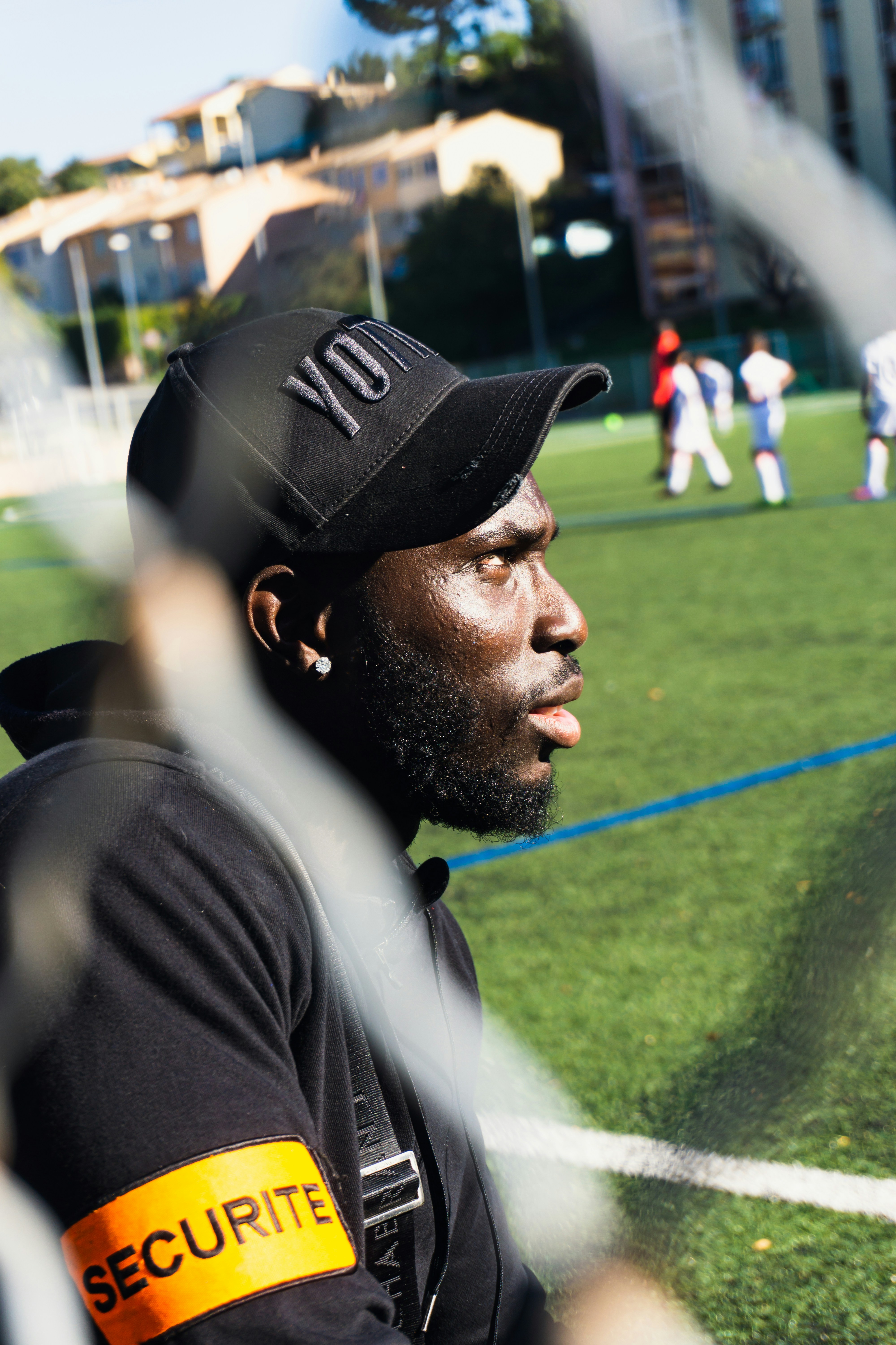 Focused Gaze on the Field: A Portrait Inside a Net