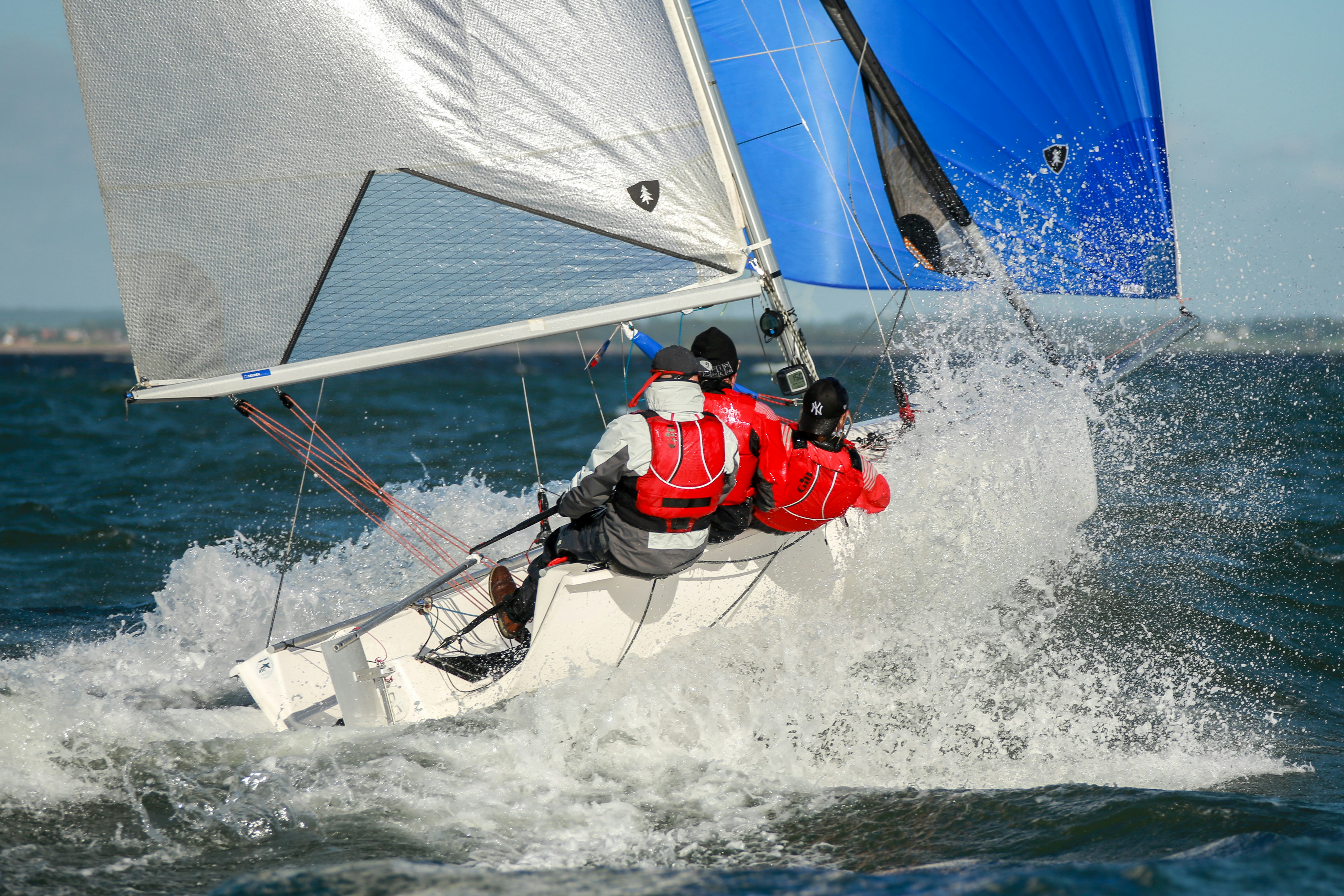 A man riding a sailboat on top of a body of water photo – Free Halmstad ...