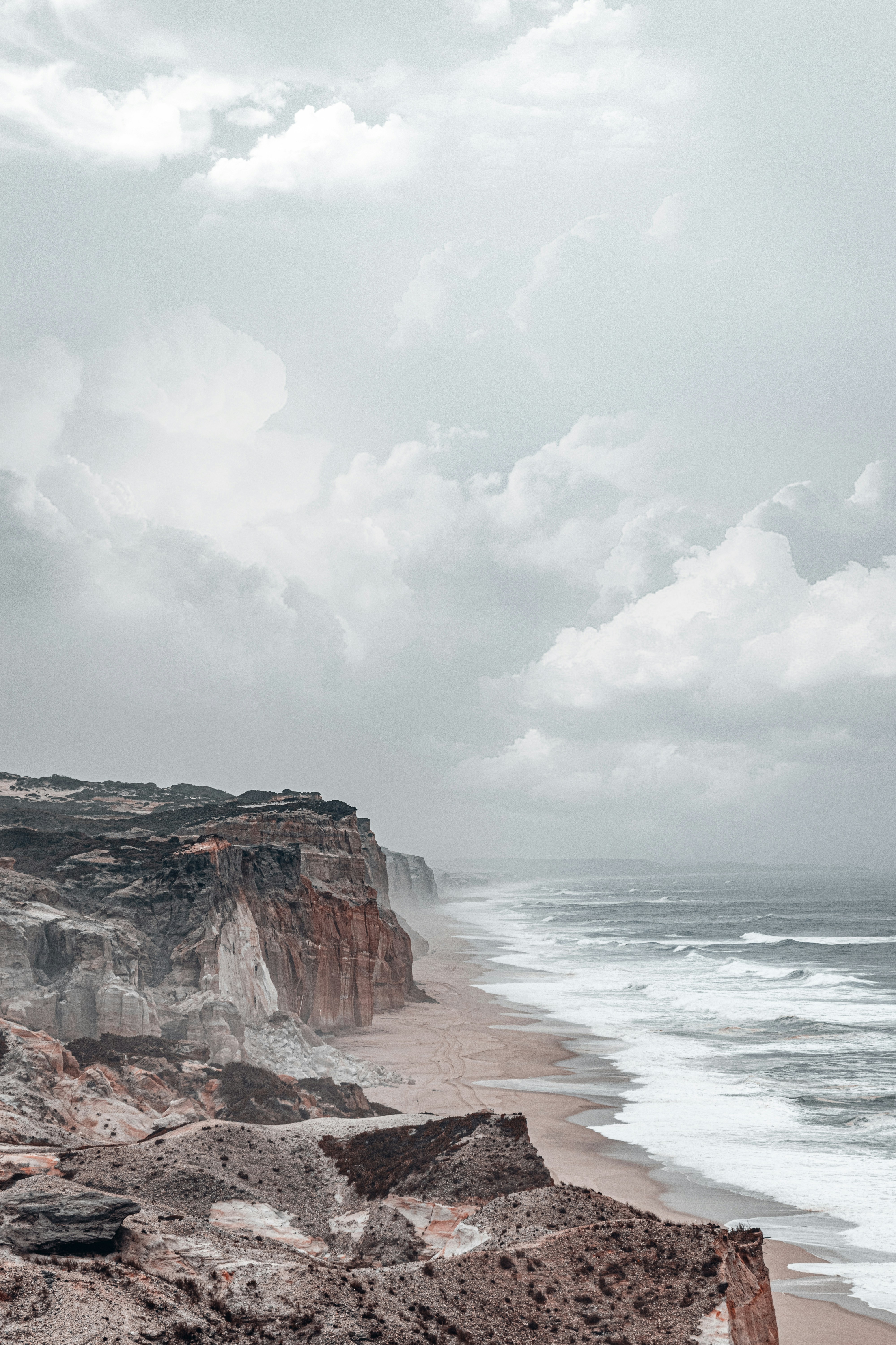 Edge of Erosion: Cliffline and Sea Under Clouded Light