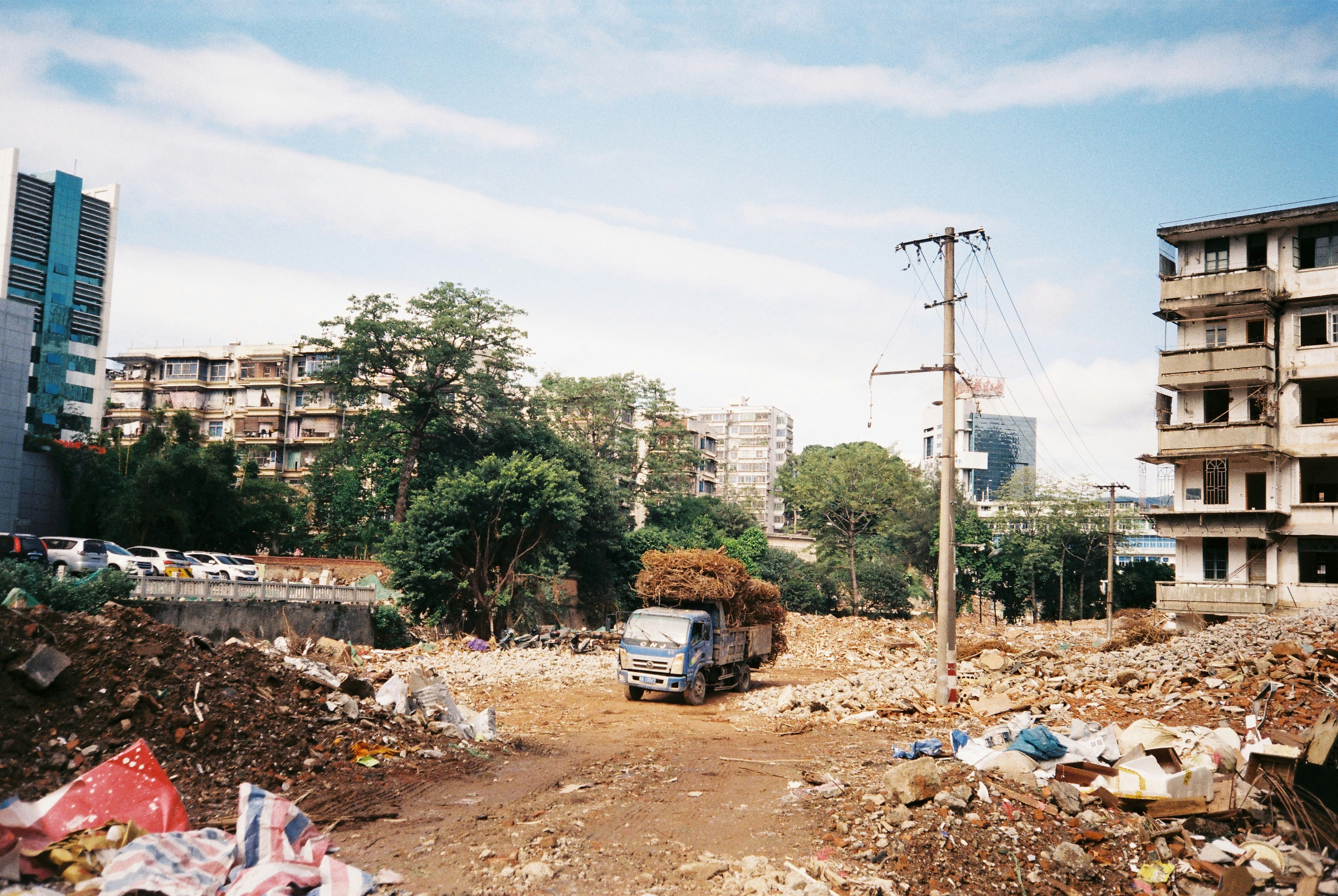 A truck is parked in a dump yard photo – Free Fujicolor c200 Image on ...