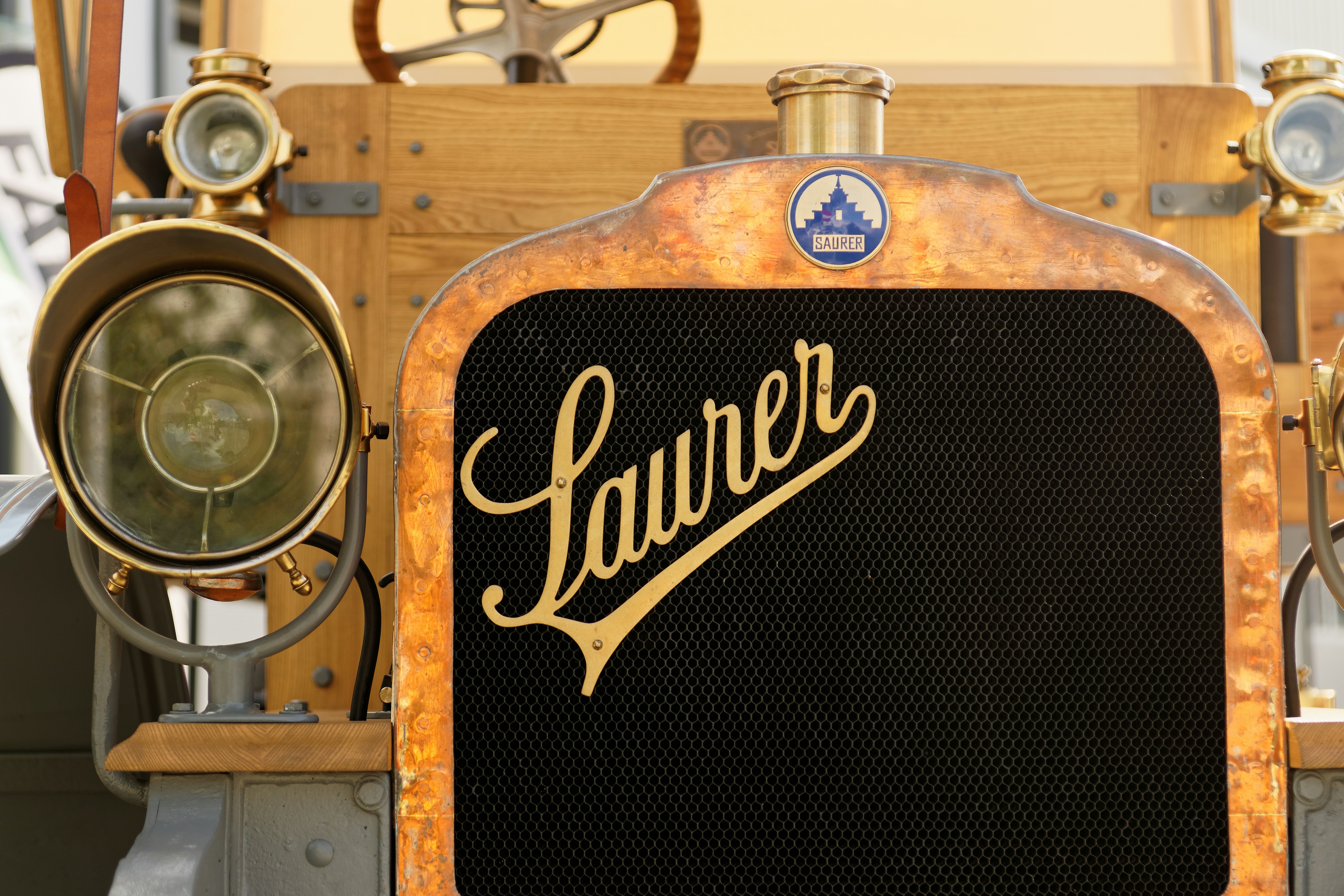 Detailed view of a vintage Laurer automobile's front grille showcasing the iconic logo and classic design elements.
